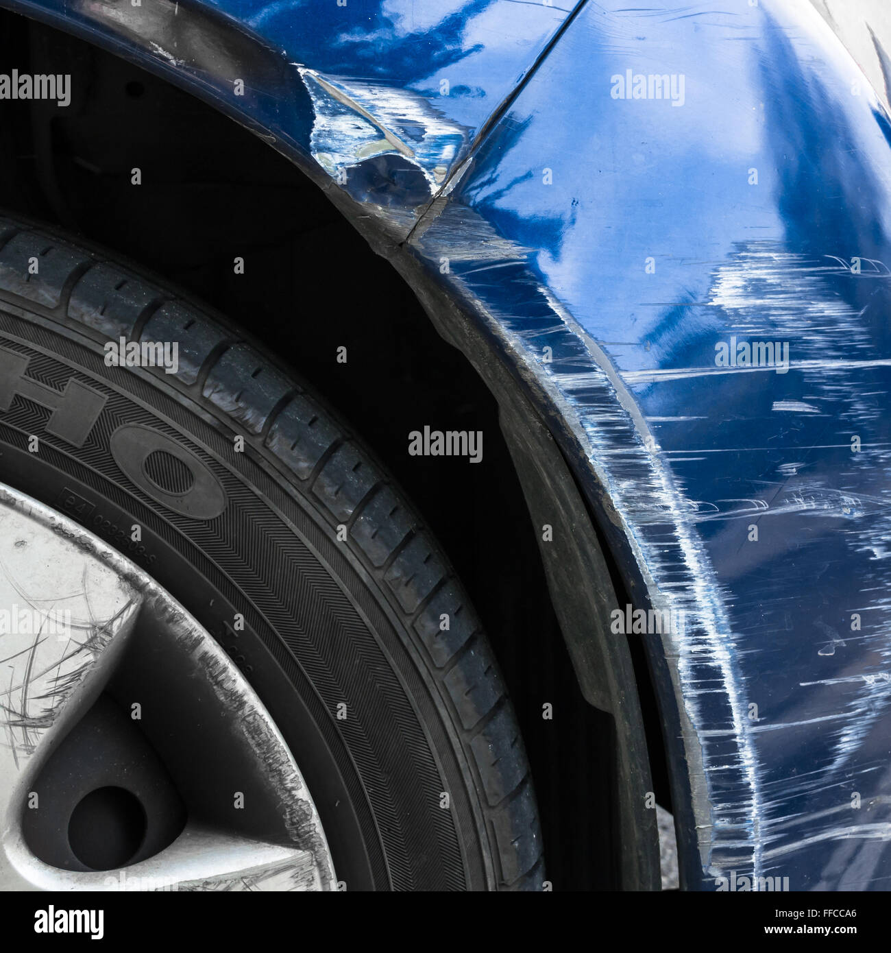 Accident damage to the front side of a blue car Stock Photo - Alamy