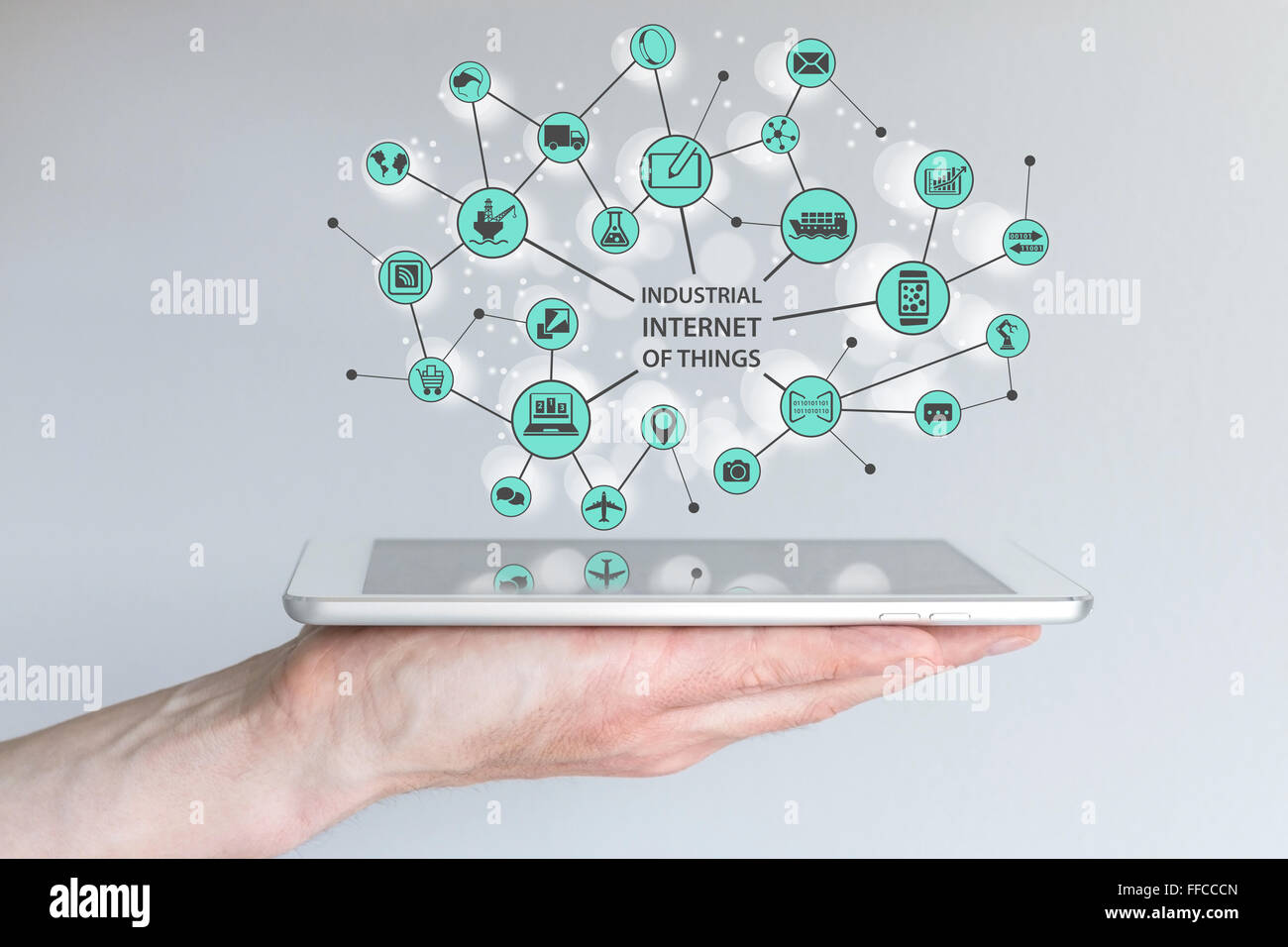 Industrial internet of things IOT concept. Male hand holding modern ...