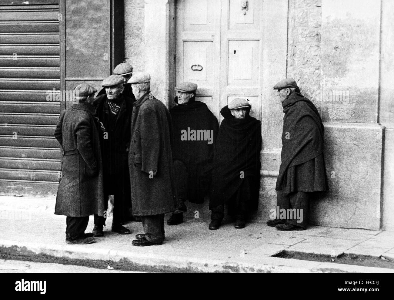ITALY: UNEMPLOYMENT, 1955. /nLandless farm workers standing in the town ...