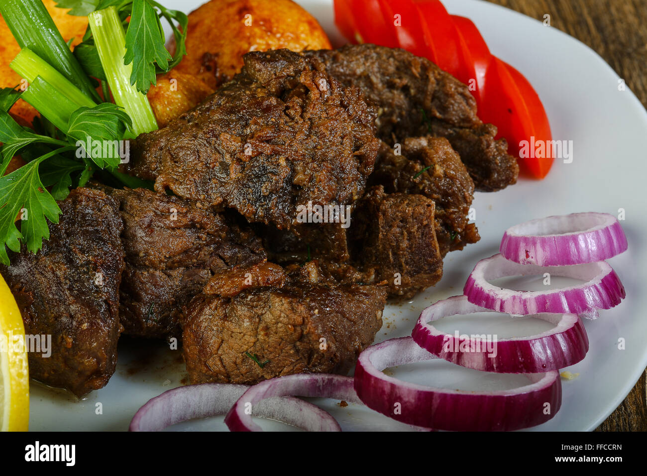 Hot juicy grilled liver with potato Stock Photo - Alamy