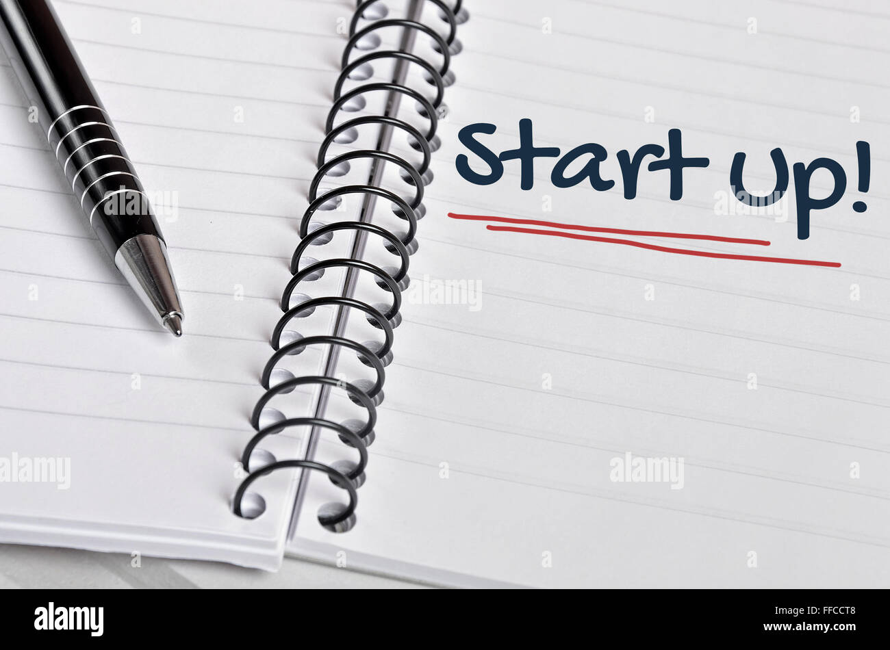 Start up word written on notebook page Stock Photo - Alamy