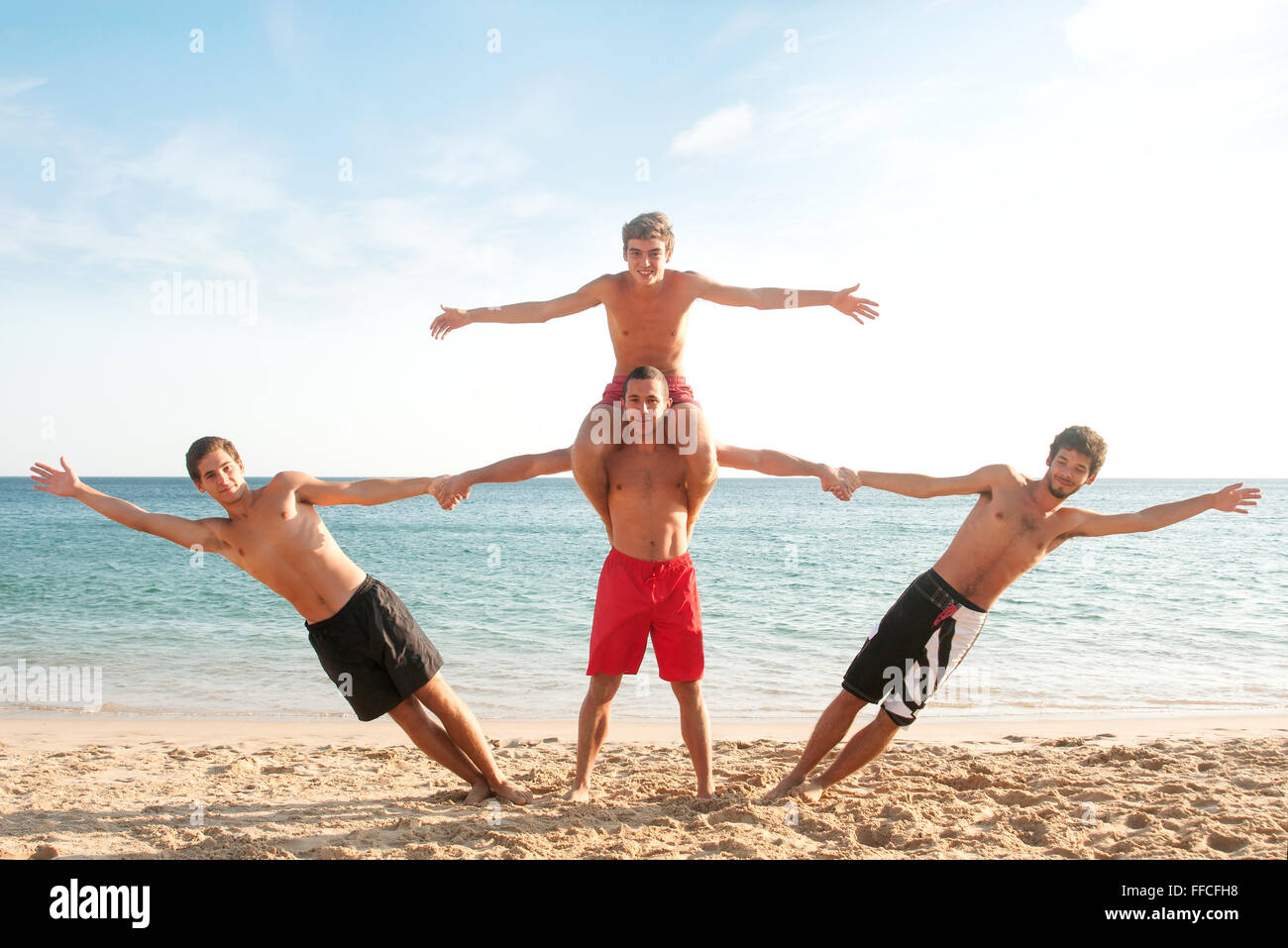 Group of happy boys at the beach Stock Photo - Alamy