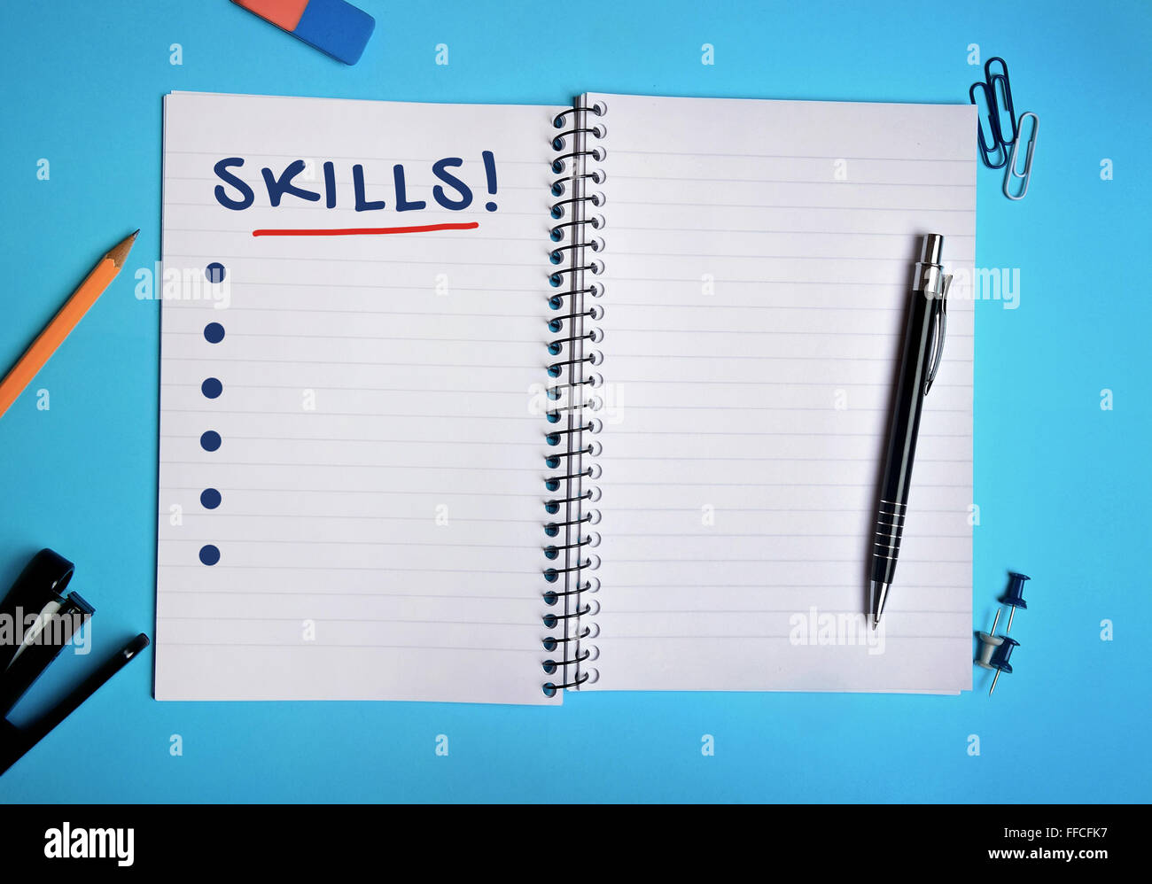 Skills word written on notebook page Stock Photo - Alamy
