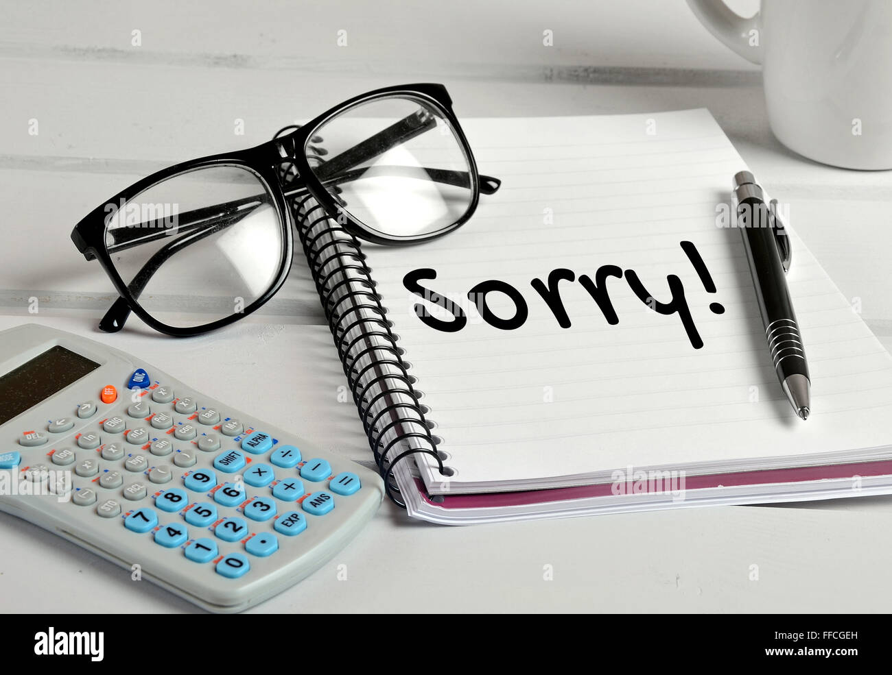 Sorry word on notebook page Stock Photo - Alamy