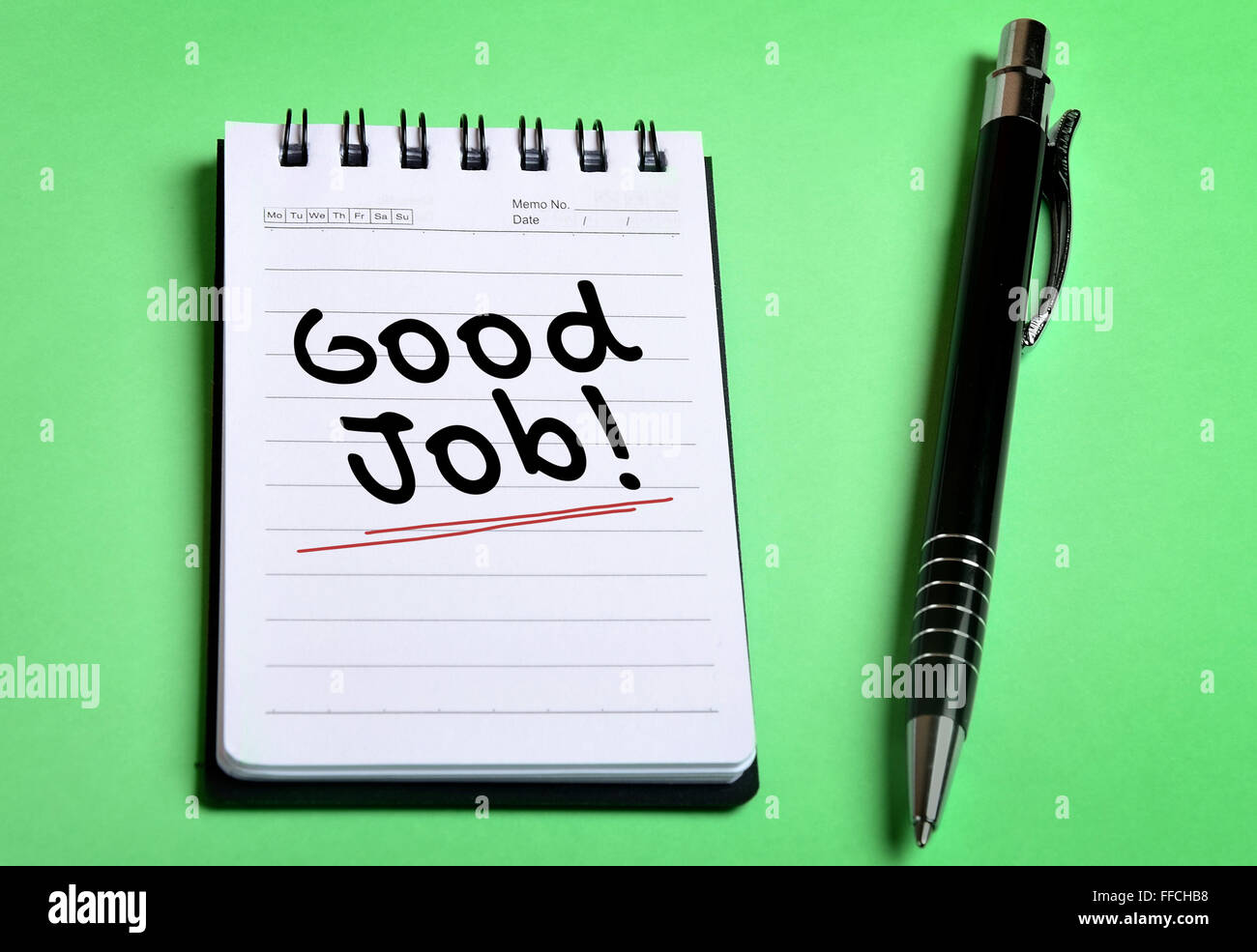 Good Job word on notebook page Stock Photo - Alamy