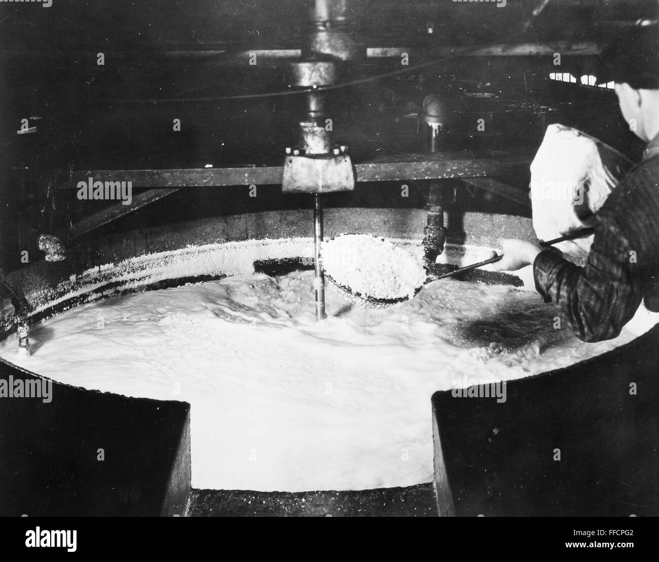 RUBBER PROCESSING, c1940. /nProcessing raw synthetic rubber (Ameripol ...