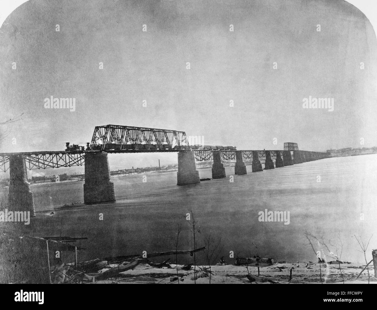 OHIO RIVER BRIDGE, 1870. /nThe first passenger train passing over the ...