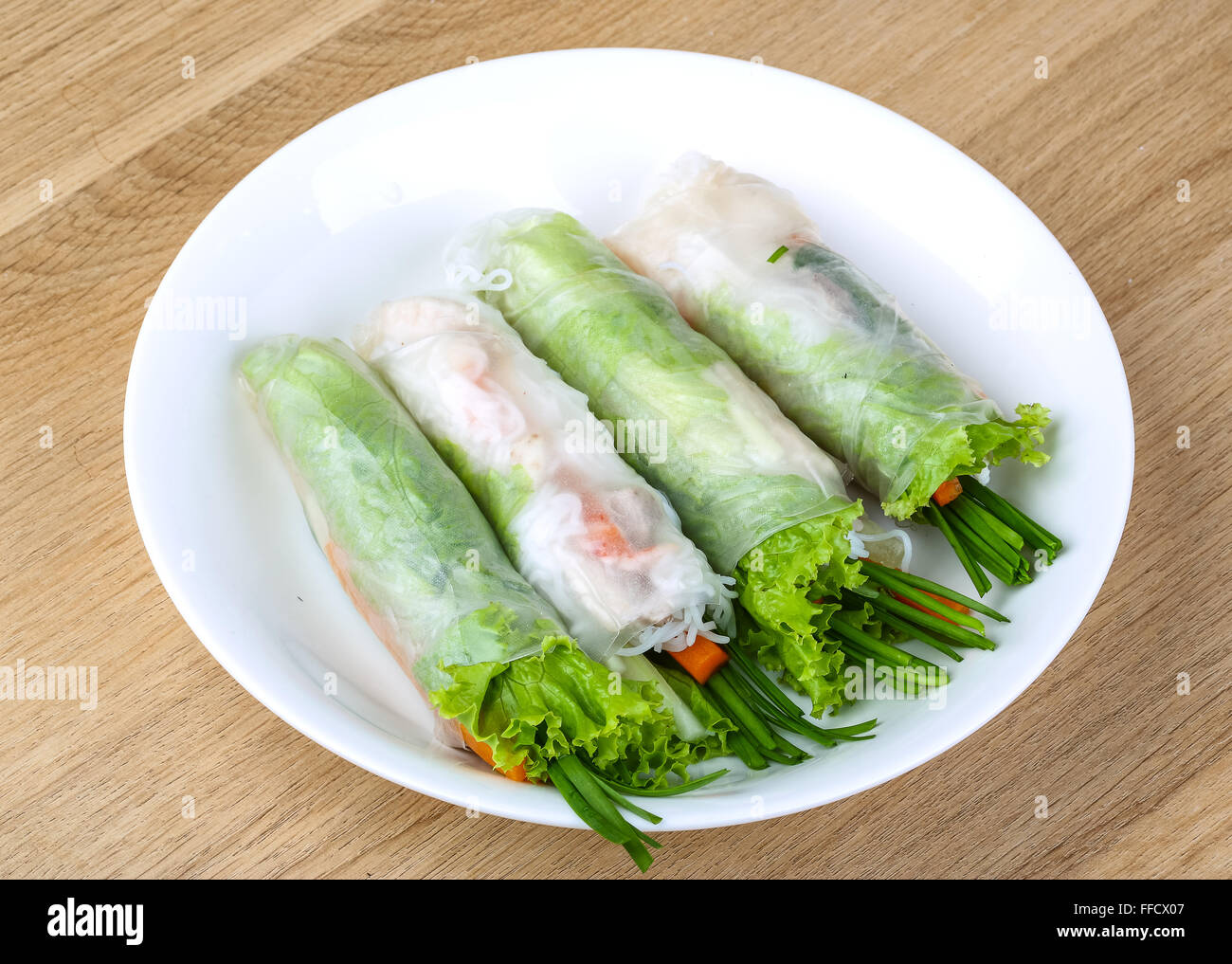 Asian traditional spring rolls on the wood background Stock Photo - Alamy
