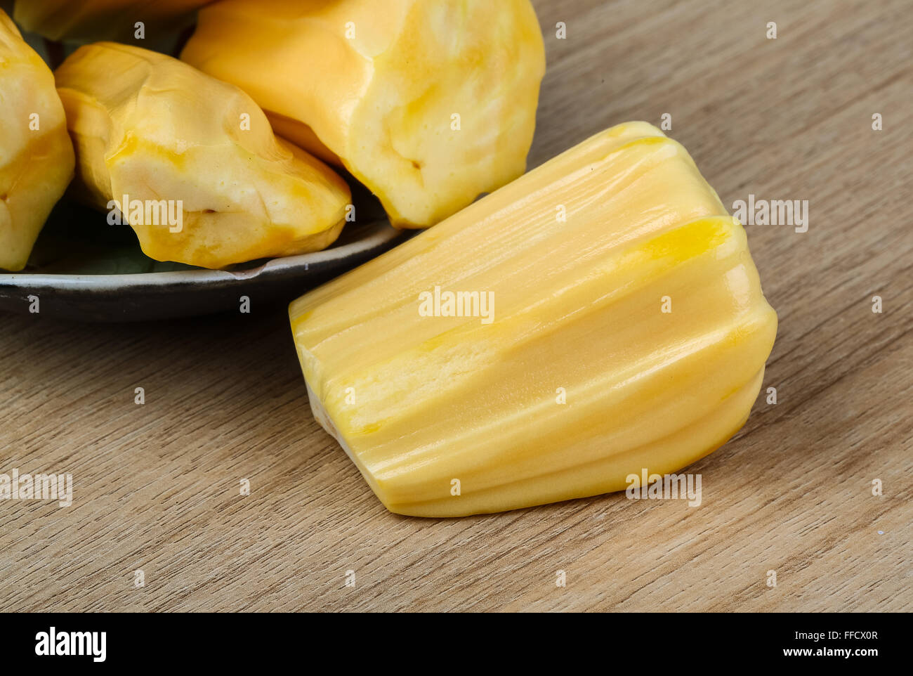 Tropical Jack Fruit on the wood background Stock Photo - Alamy