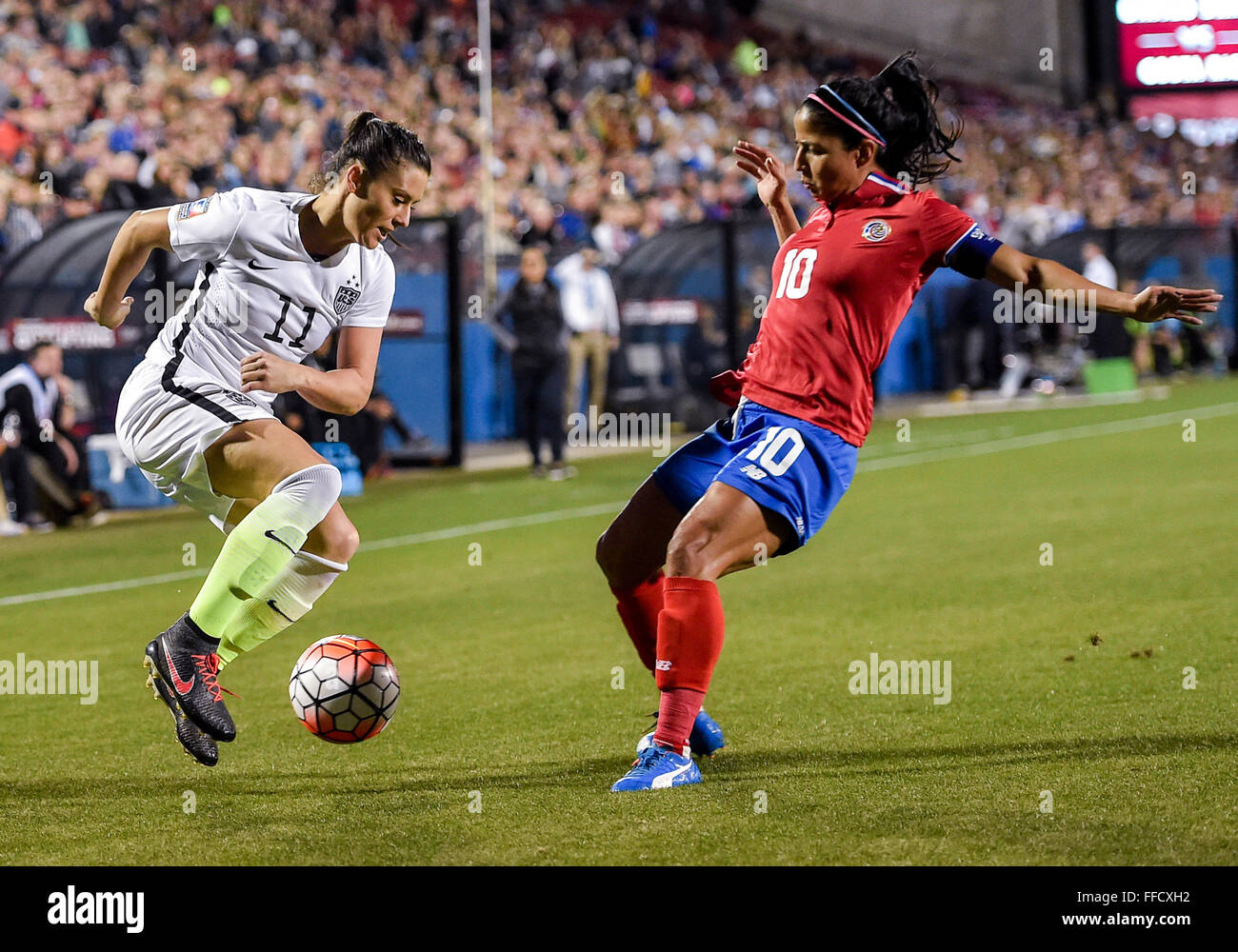 USA Defender Ali Krueger (11) with the ball as Costa Rica Shirley Cruz ...