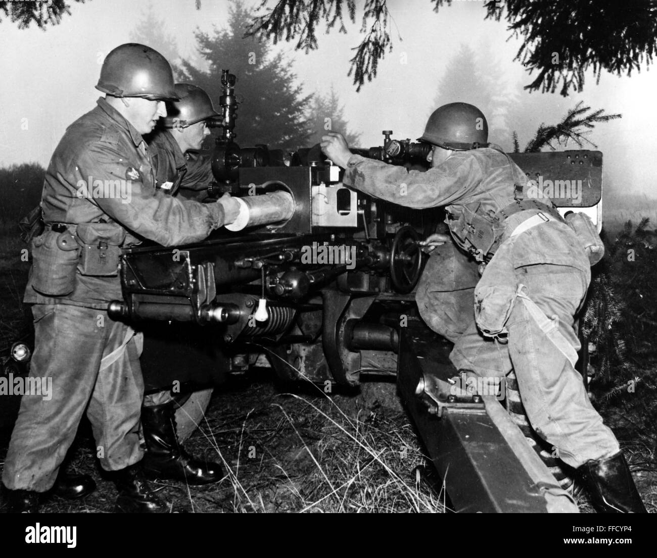 U.S. ARMY TRAINING. /nA U.S. Army gun crew prepares to fire a 105mm ...