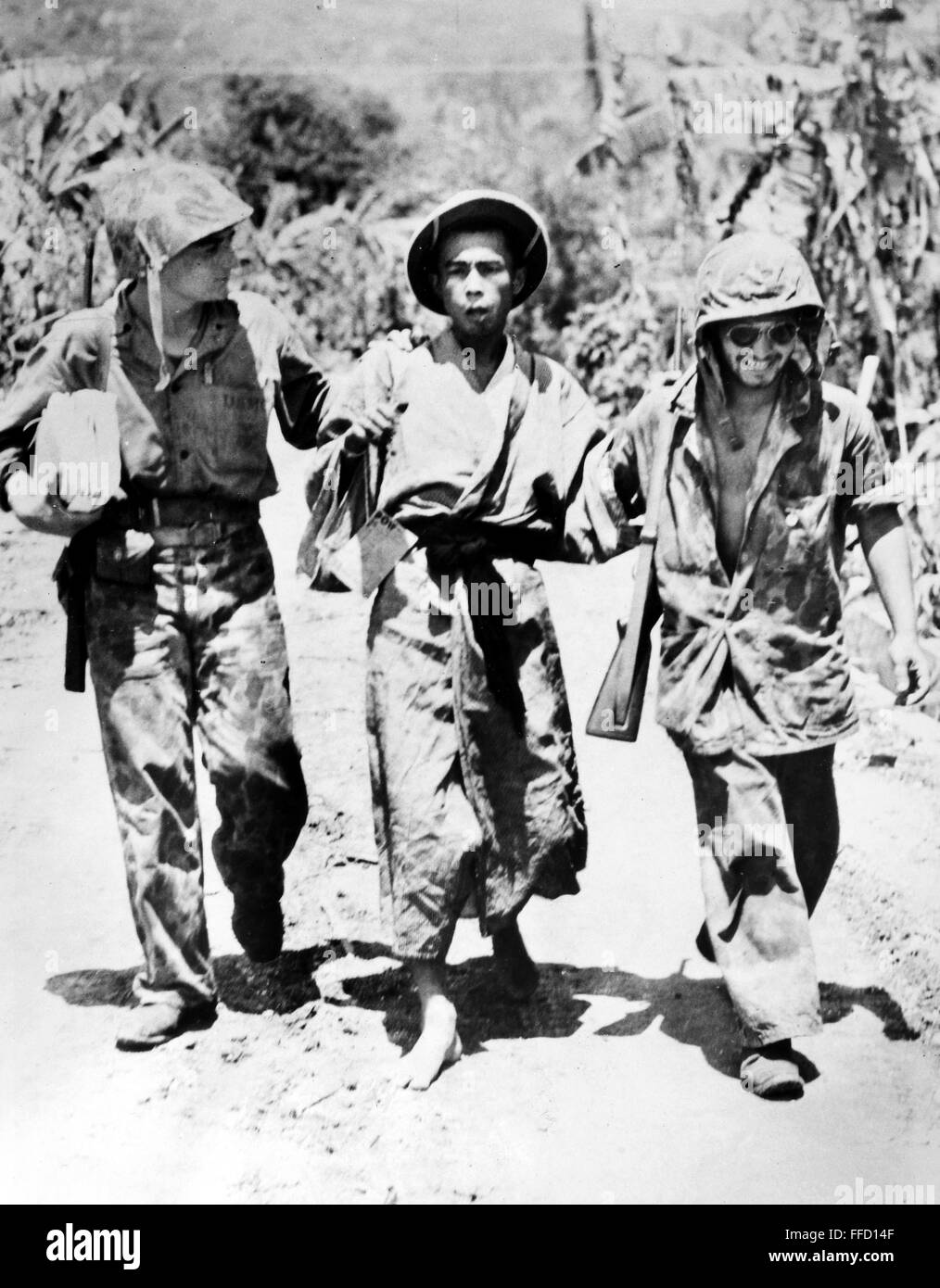 WORLD WAR II: SAIPAN, 1944. /nTwo U.S. Marines interning a Japanese ...