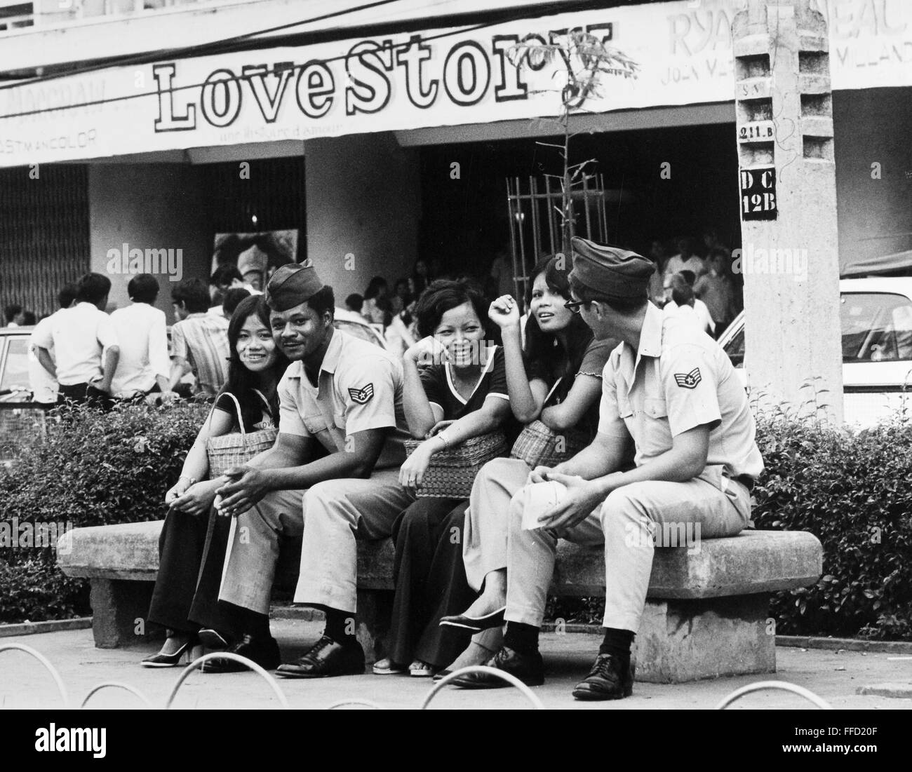VIETNAM, 1972. /nAmerican soldiers and Vietnamese women in front of a ...