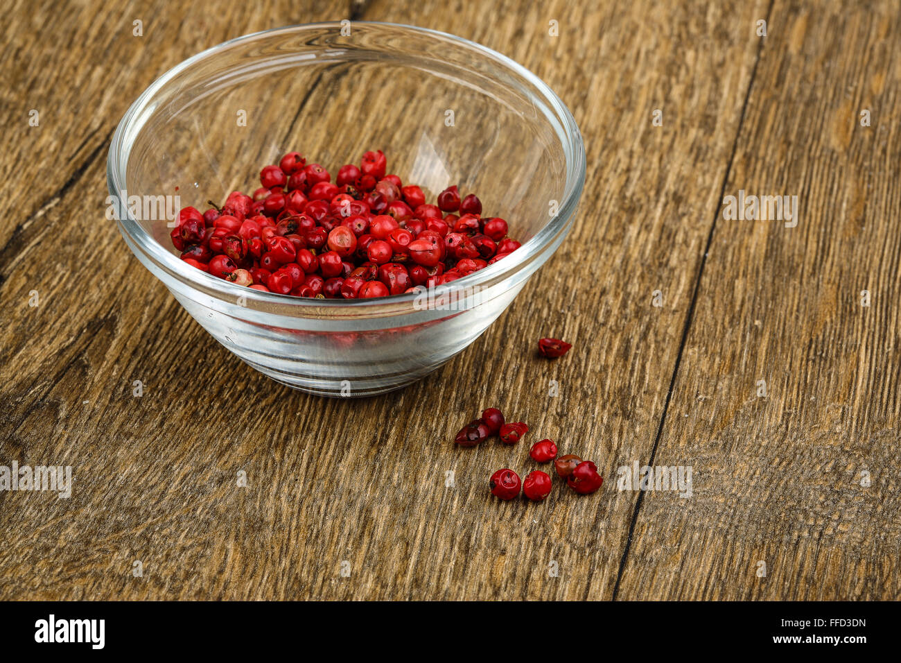 Dry Rose pepper corn on the wood background Stock Photo - Alamy