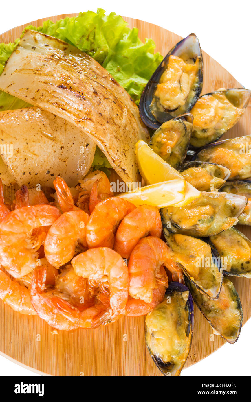 Shrimps, mussels, fish with lemon Stock Photo - Alamy