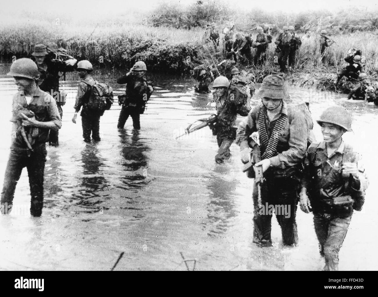 VIETNAM WAR: VIETNAMIZATION./nAustralian troops cross a stream during a ...