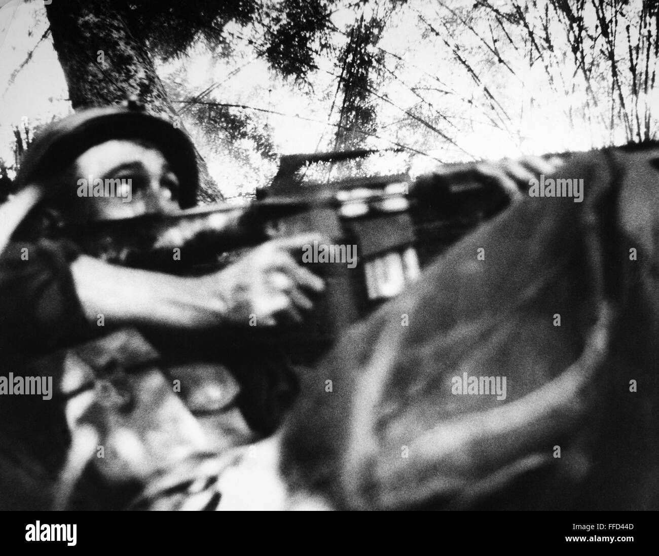 VIETNAM WAR: U.S. SOLDIER. /nAn American soldier firing at Viet Cong in ...