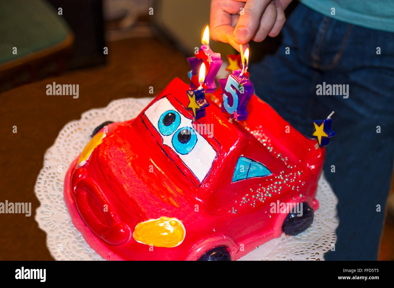 pie the car red with candles to birthday of the child,a pie ...