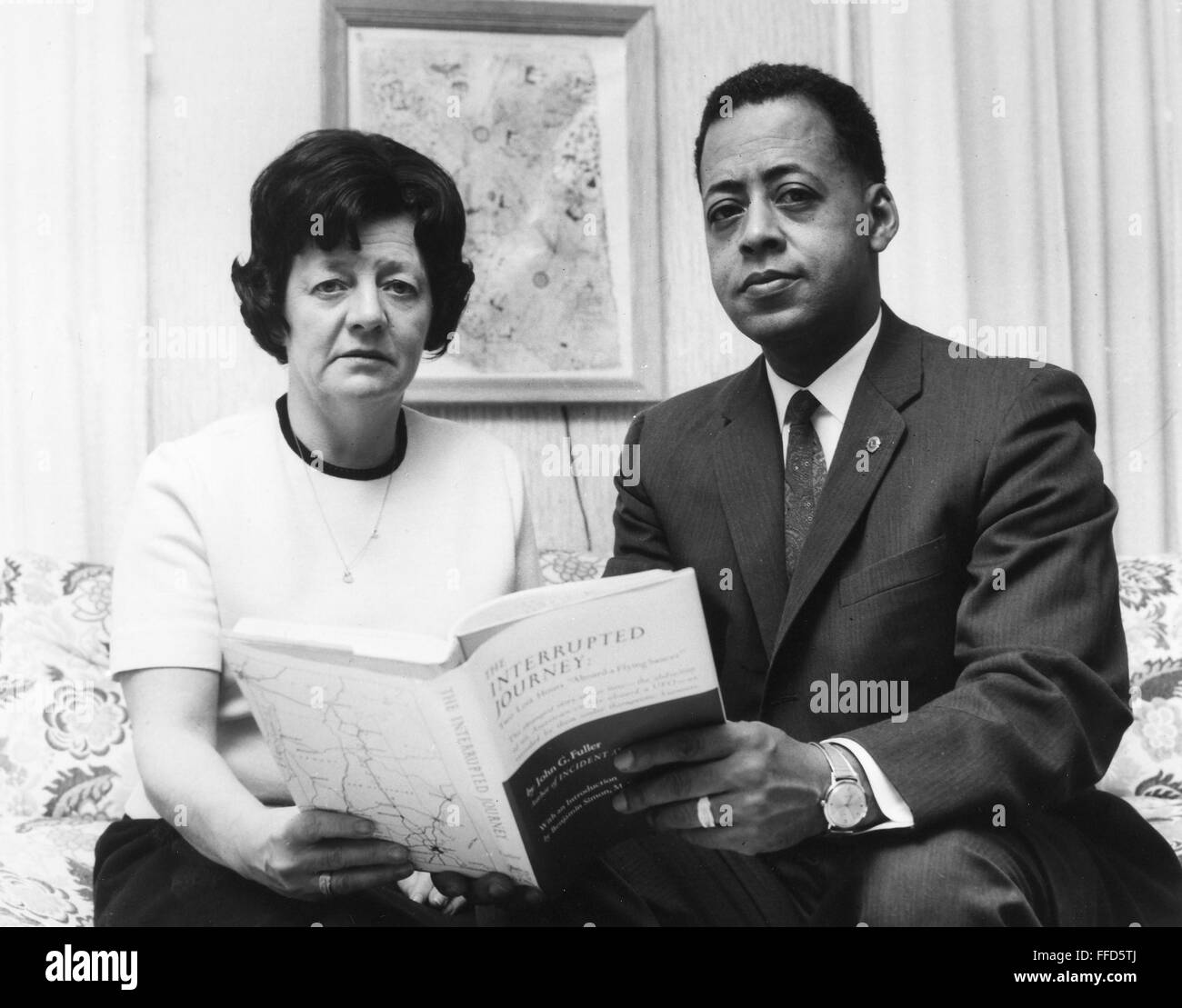ALIEN WITNESSES, 1967. /nBetty and Barney Hill holding a copy of a book ...