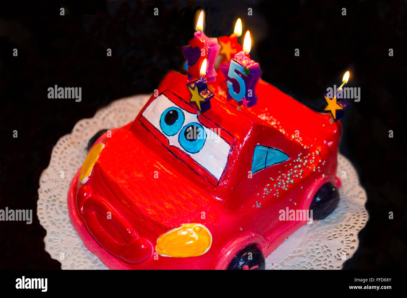pie the car red with candles to birthday of the child,a pie ...