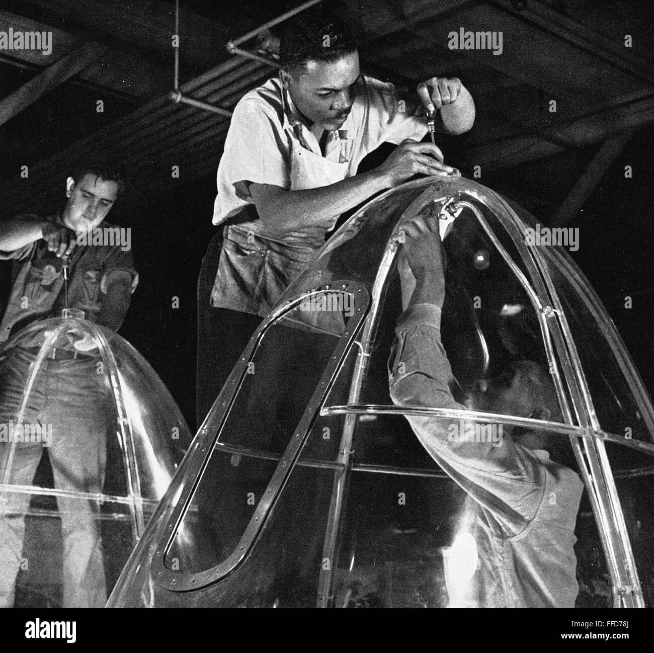 WORLD WAR II: FACTORY, 1942. /nWorkers preparing transparent plastic ...