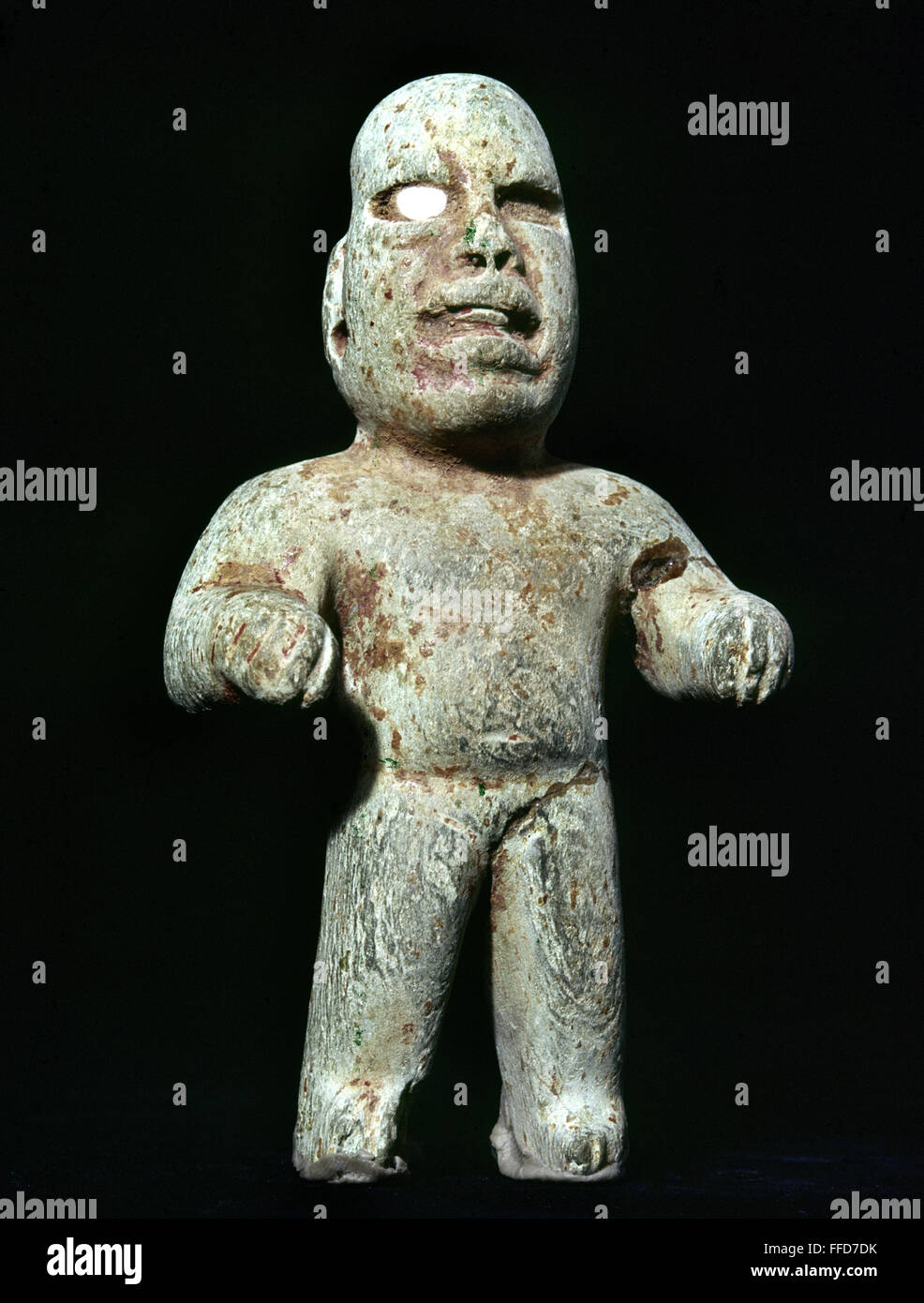 MEXICO: OLMEC FIGURE. /nCarved green serpentine standing figure with a ...