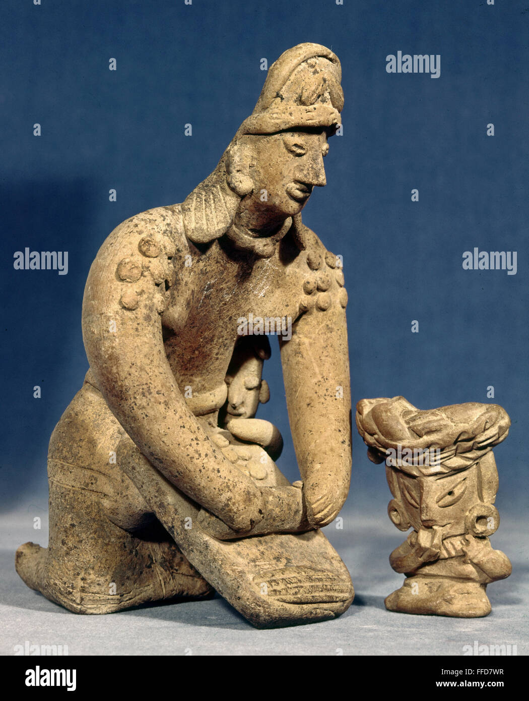 MEXICO: WOMAN WITH METATE. /nA Pre-Columbian Mexican woman grinding ...