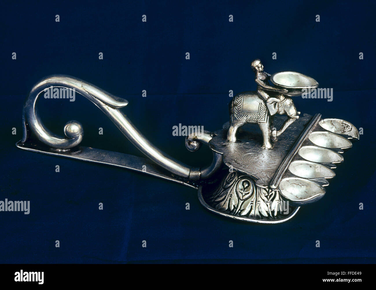 INDIAN CEREMONIAL LAMP. /nSilver hand-held lamp used to invoke the ...