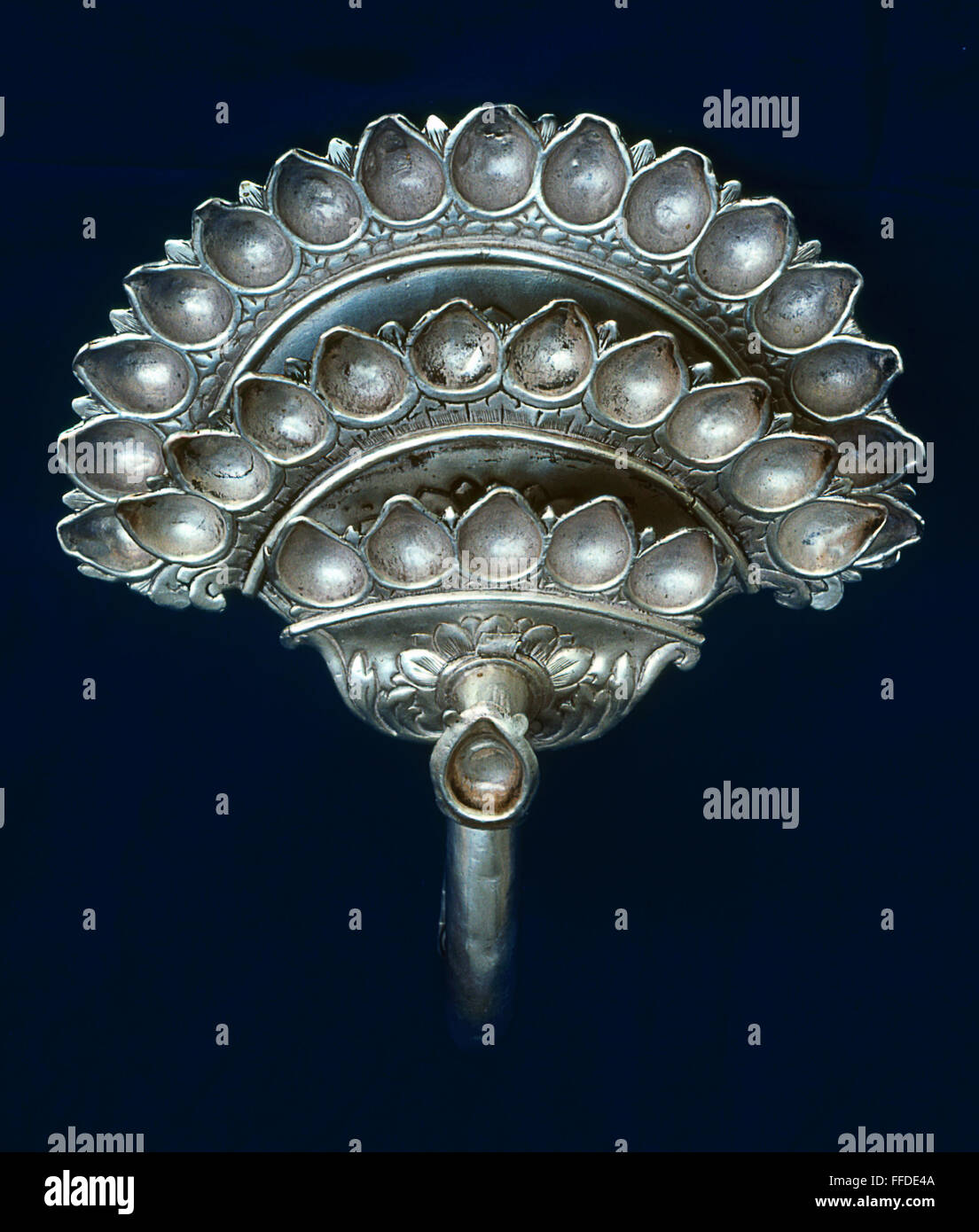 INDIAN CEREMONIAL LAMP. /nSilver hand-held lamp with thirty bowls, used ...