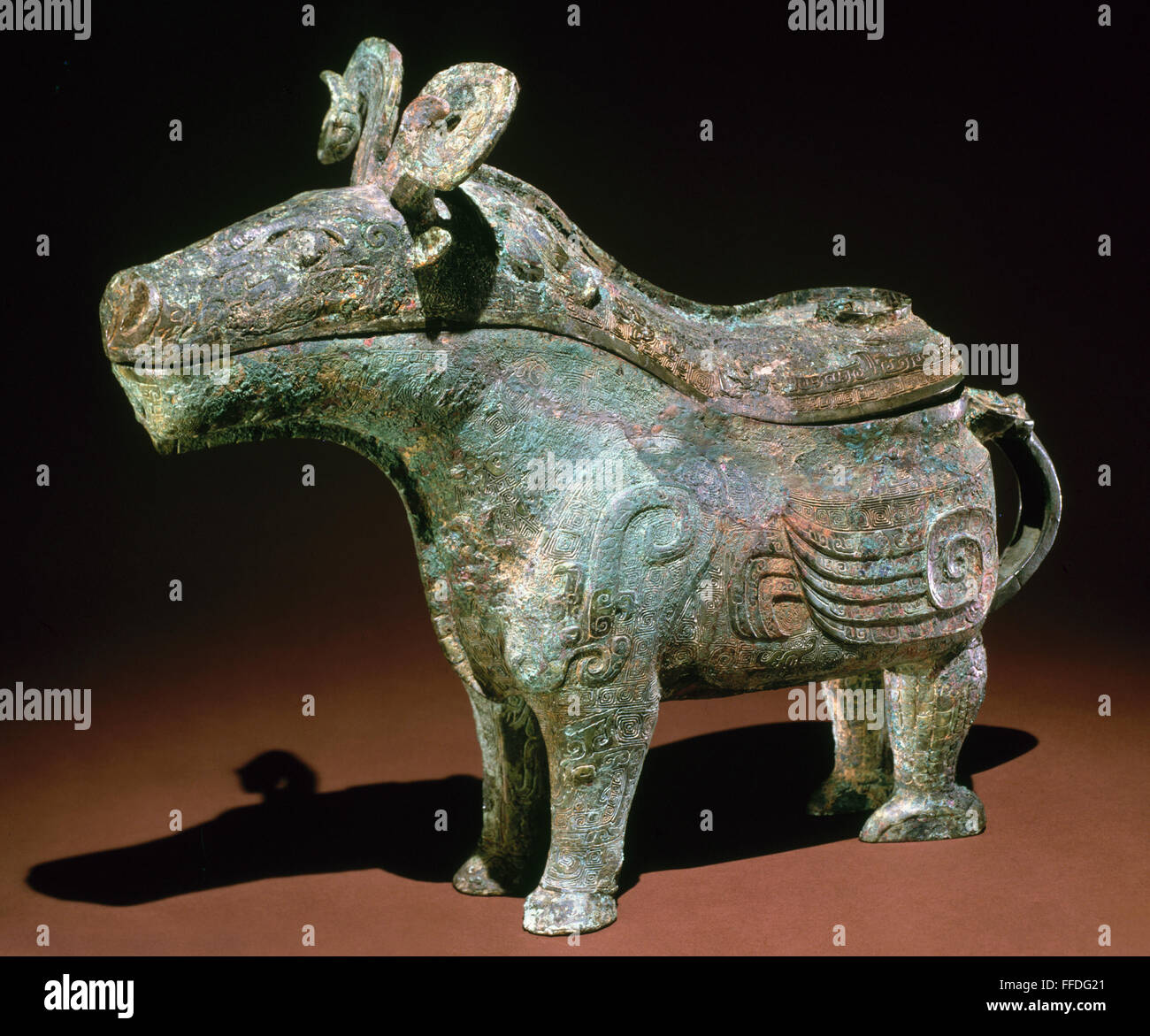 CHINA: BRONZE VESSEL. /nBronze 'guang' vessel in the form of a dragon ...