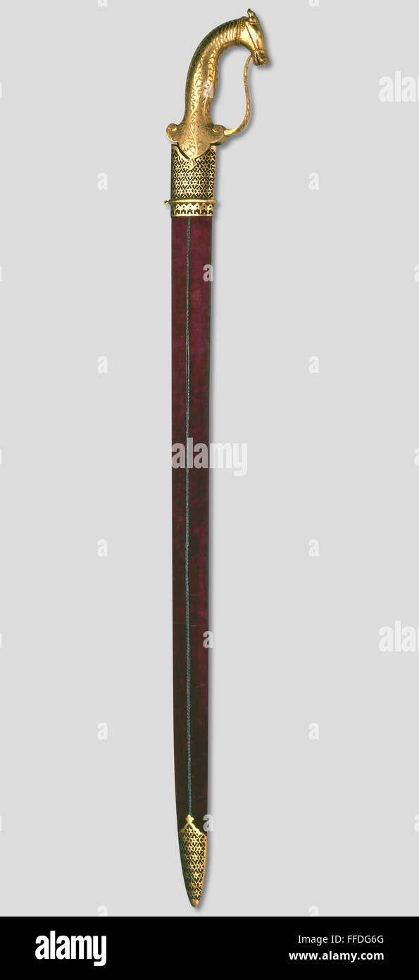 INDIAN SWORD. /nIndian sword with a gold plated hilt in the shape of a ...