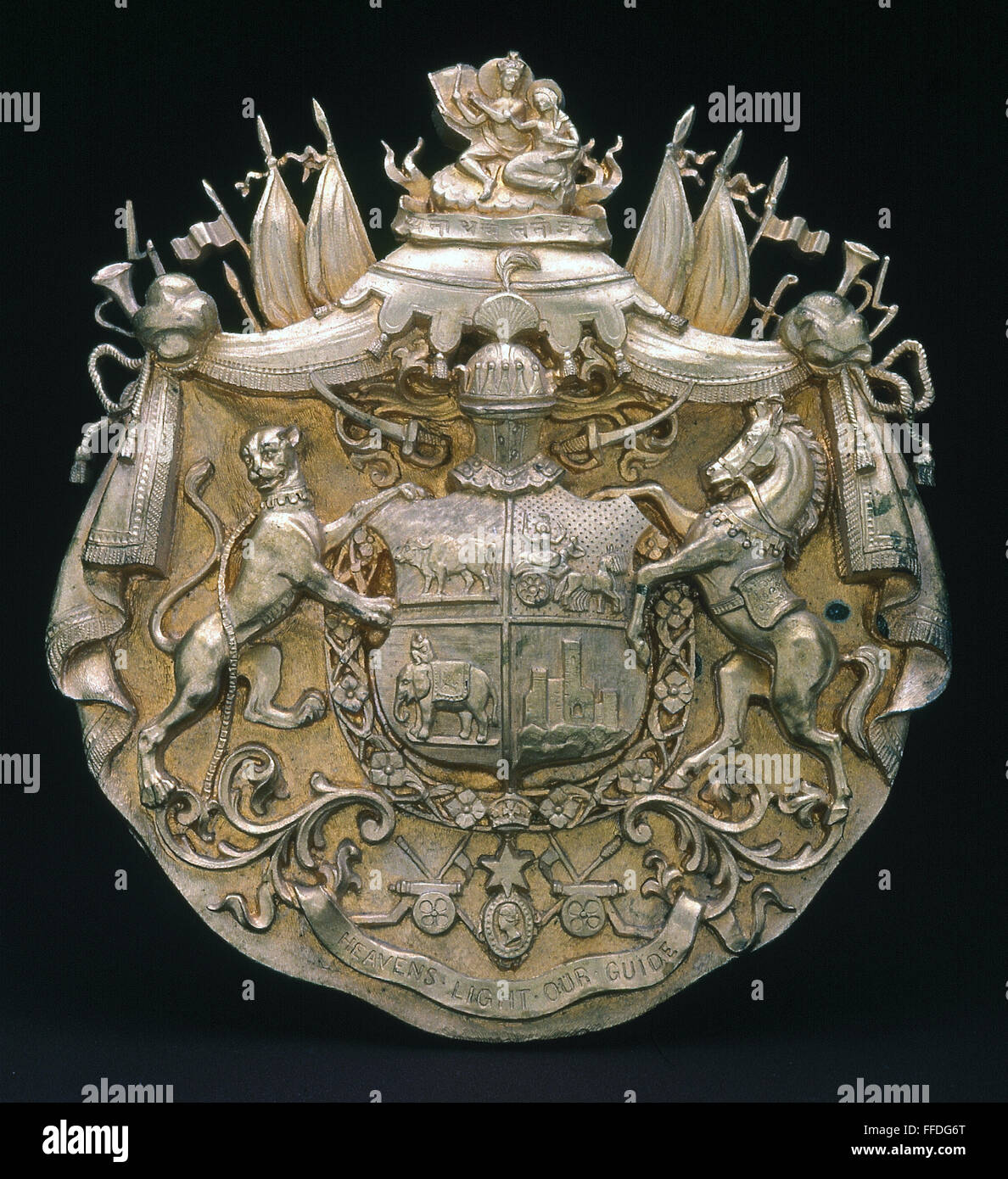 INDIAN DECORATIVE SHIELD. /nDecorative gold shield with a coat of arms ...