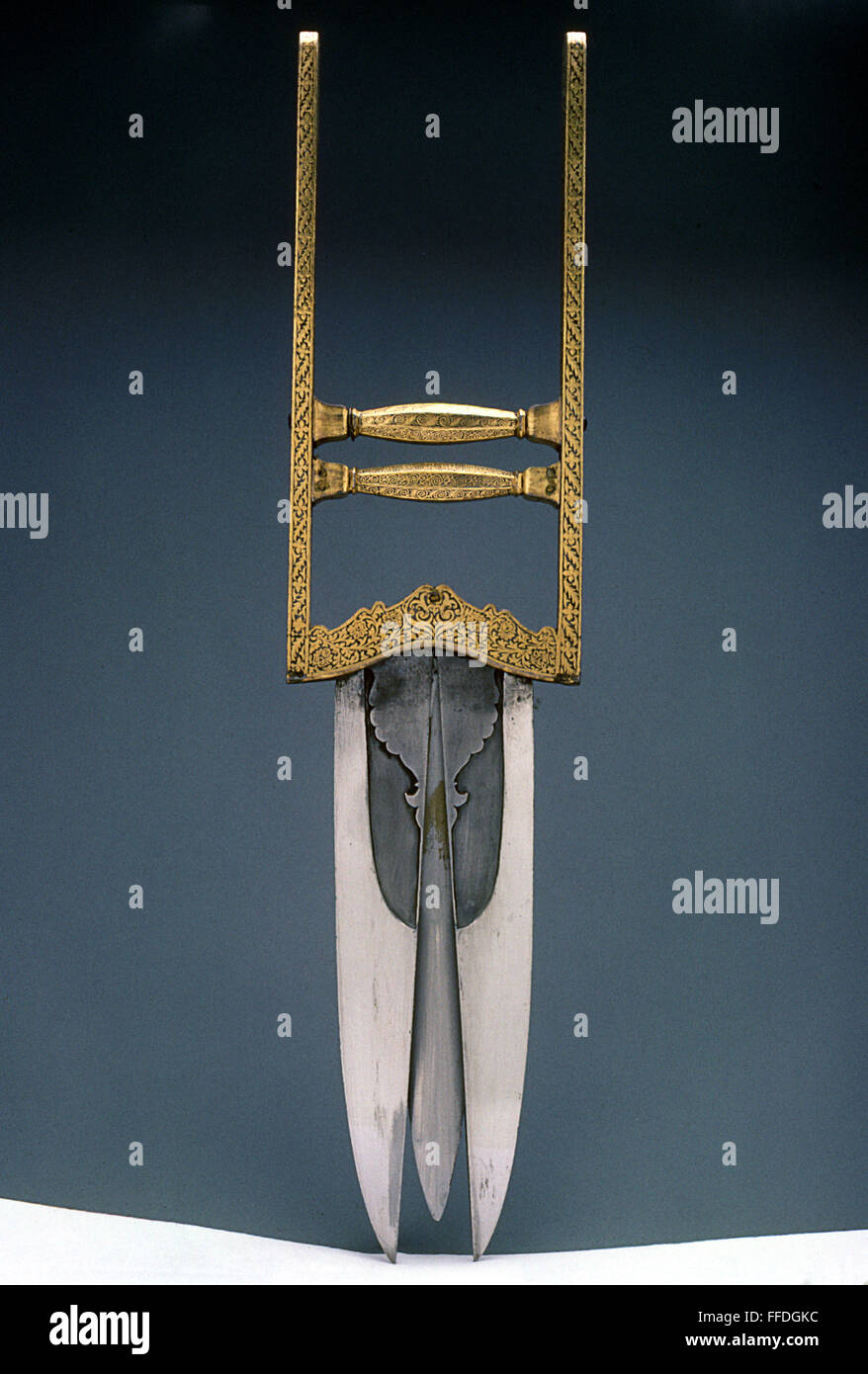 INDIAN DAGGER. /nA 'qatar,' an Indian dagger with long double handles ...