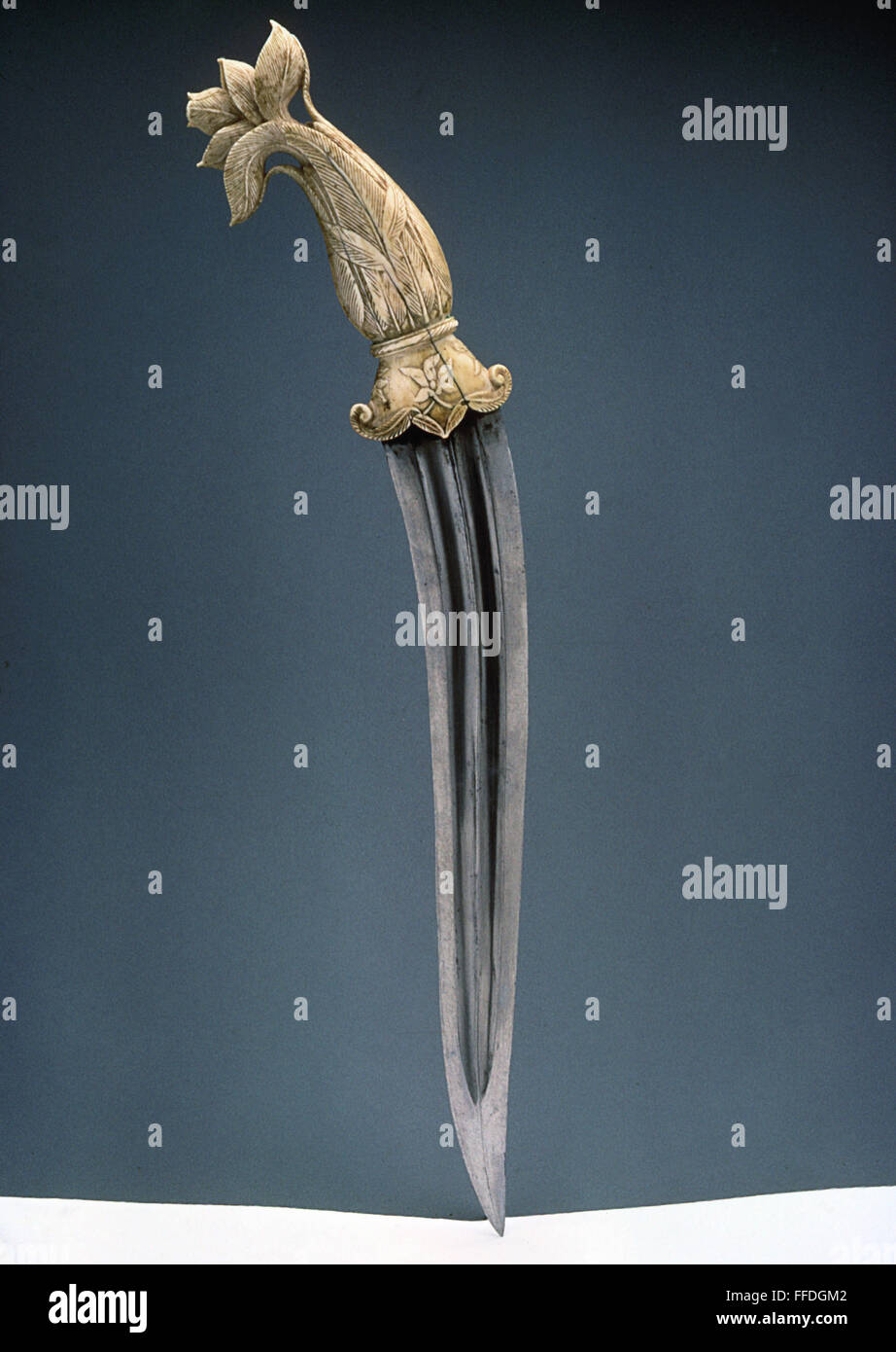 INDIAN DAGGER. /nDagger with a decorated ivory hilt. From the royal ...