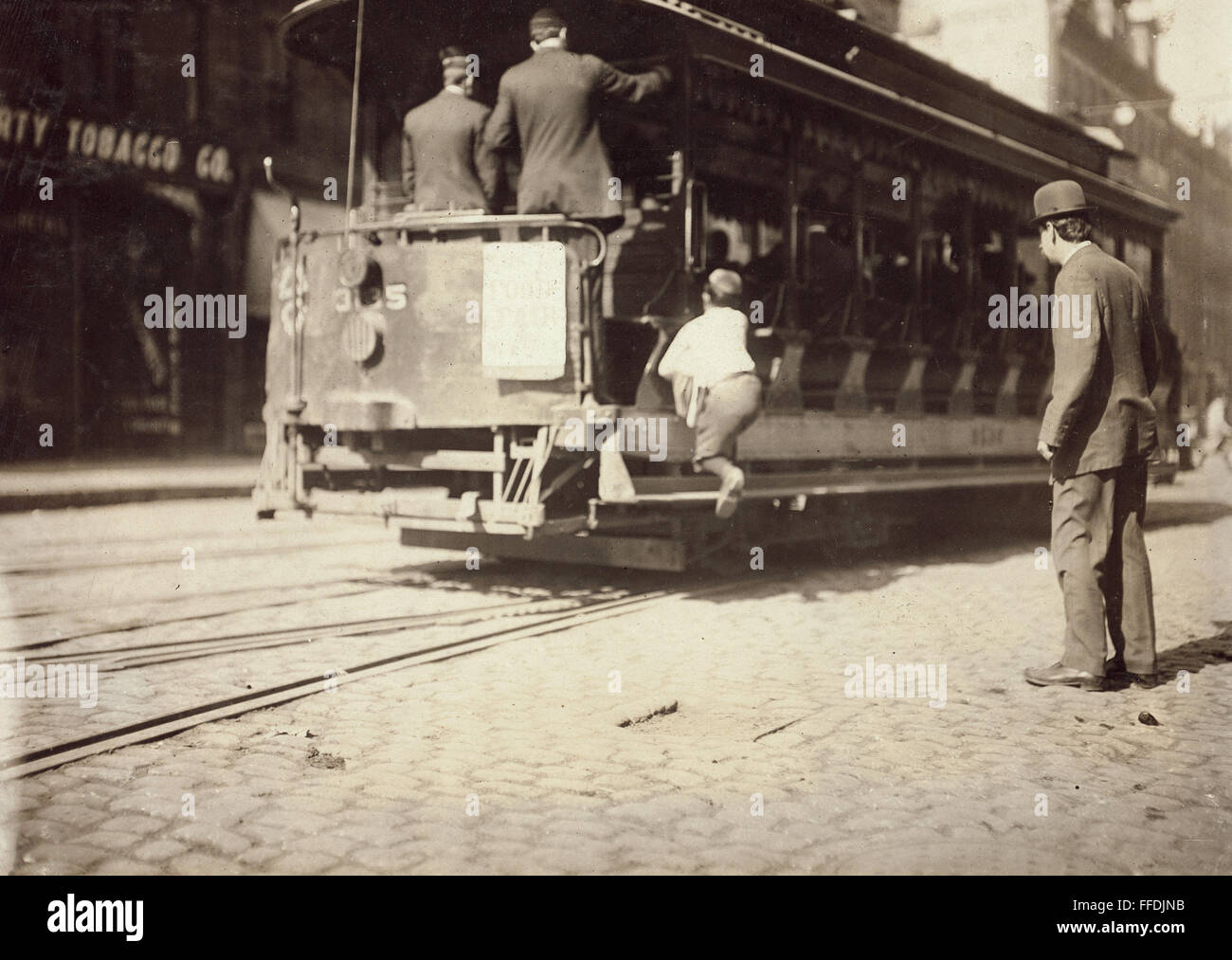BOSTON: NEWSBOY, 1909. /nA newsboy 'flipping cars," on a trolley in ...