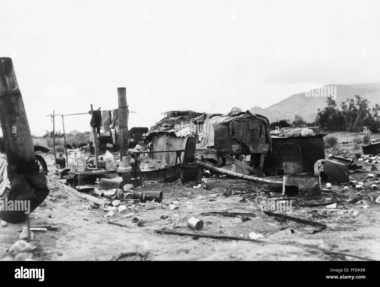 SQUATTER CAMP, 1935. /nA squatter camp with trash strewn around ...
