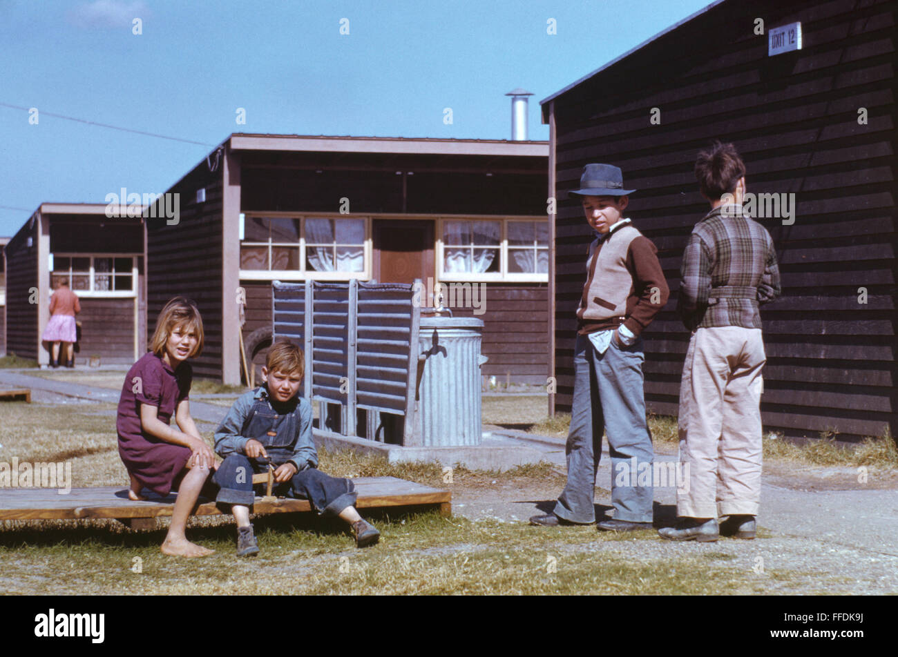 TEXAS: FSA LABOR CAMP, 1942. /nBoy building a model airplane while ...