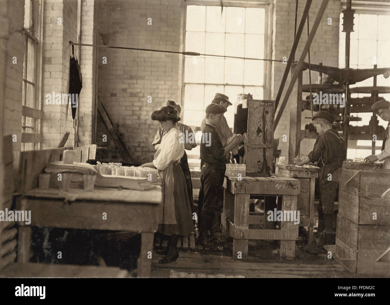 HINE: GLASS WORKERS, 1908. /nGirls, boys and men, at work polishing and ...