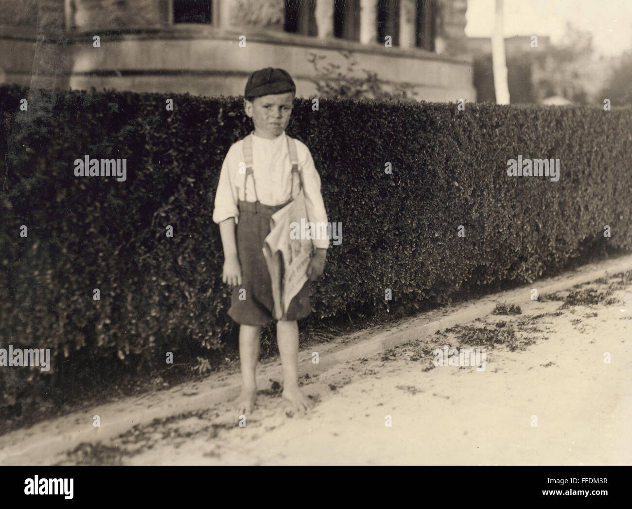 HINE: NEWSBOY, 1913. /nSix-year-old newsboy, Raymond Miller, at work in ...