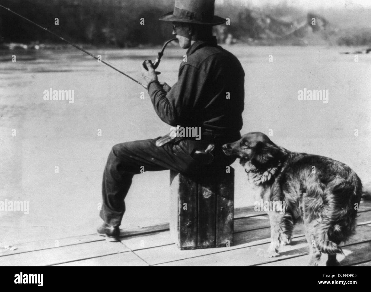 PROHIBITION, 1922. /nA dog trained to detect liquor sniffs at a flask ...