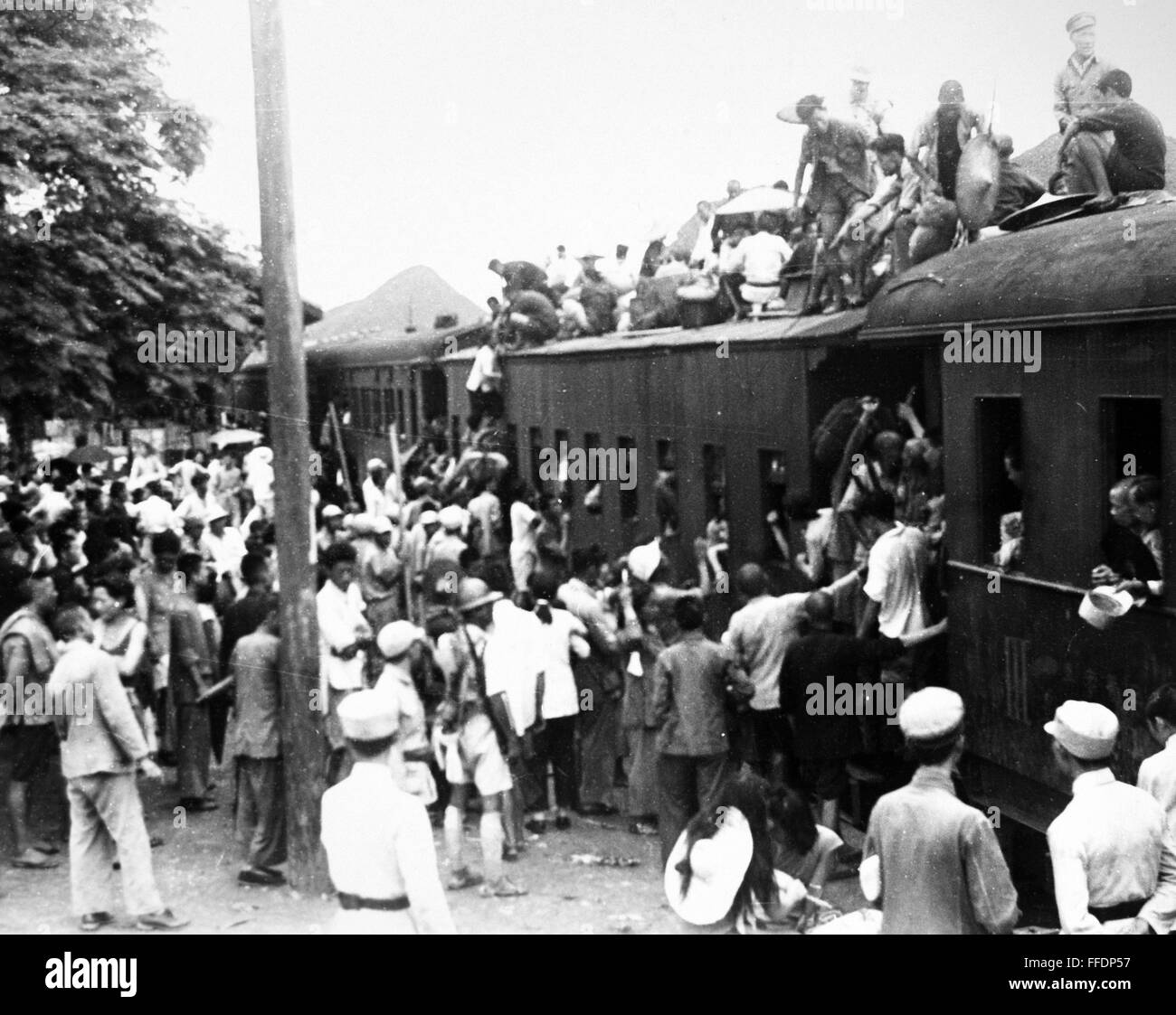 WORLD WAR II: CHINA, 1944. /nChinese citizens piling into railroad cars ...