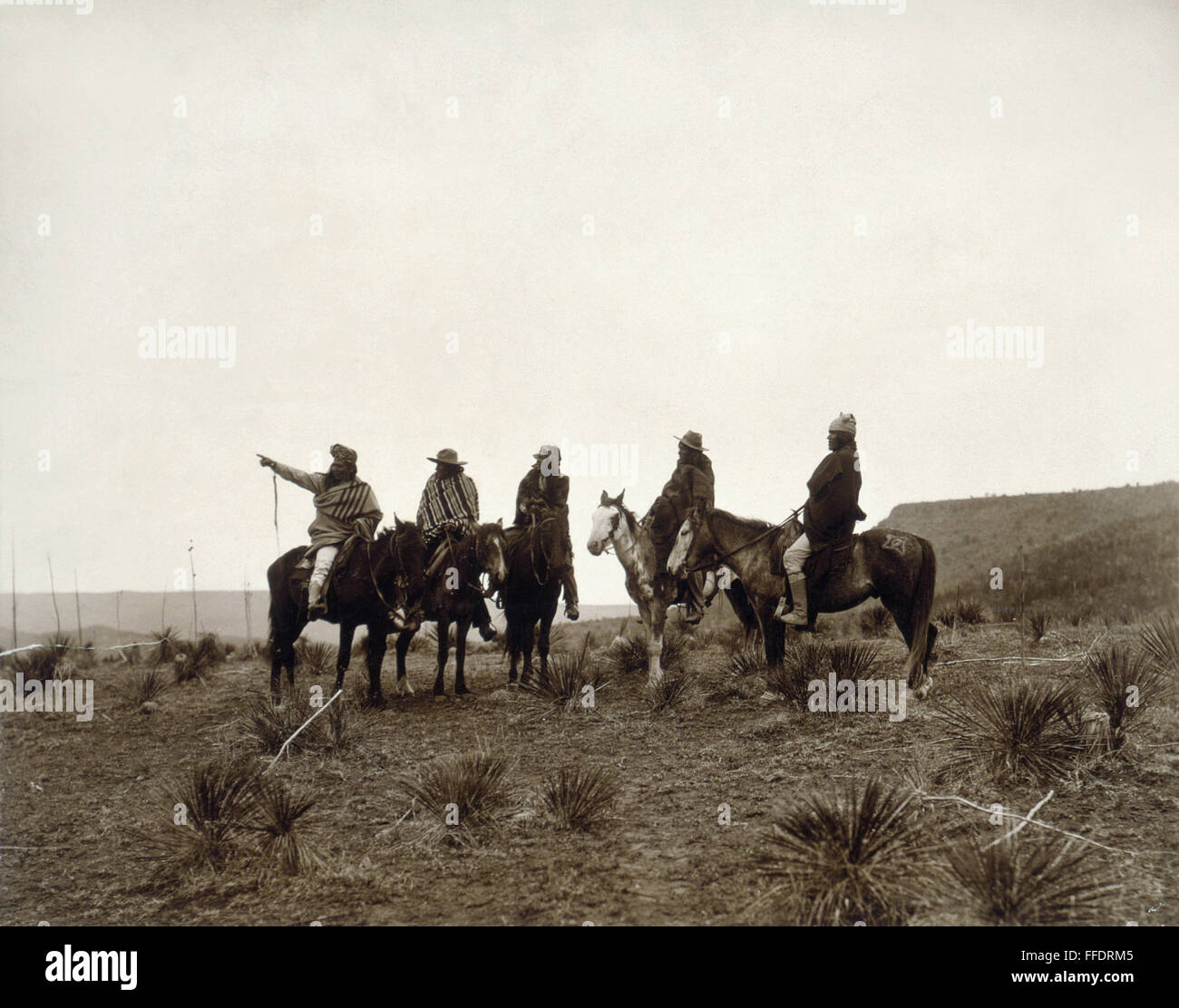 APACHE MEN, c1903. /n'The Lost Trail.' A group of Apache men on ...