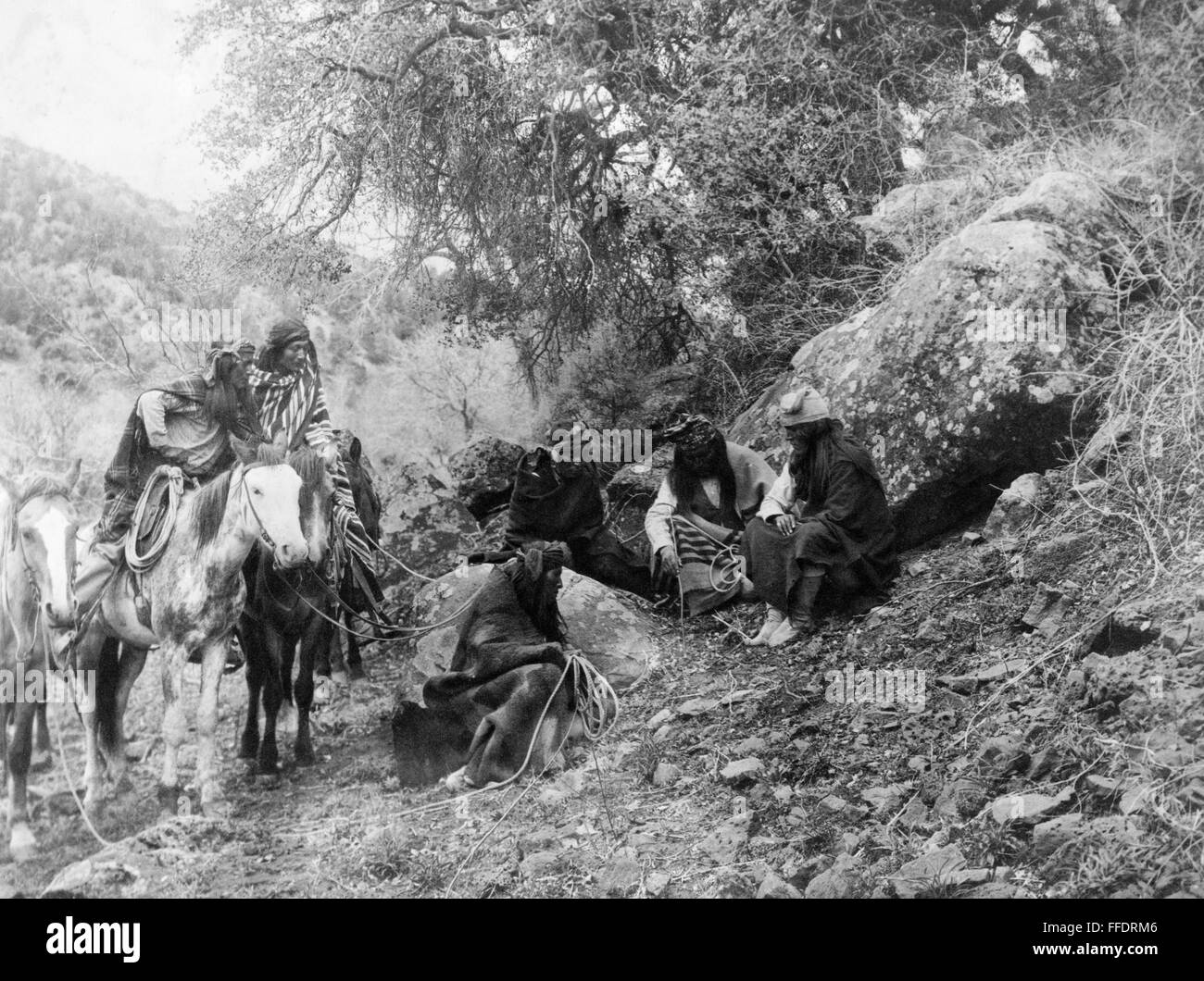 APACHE MEN, c1906. /n'Storytelling.' An Apache man marks the ground ...