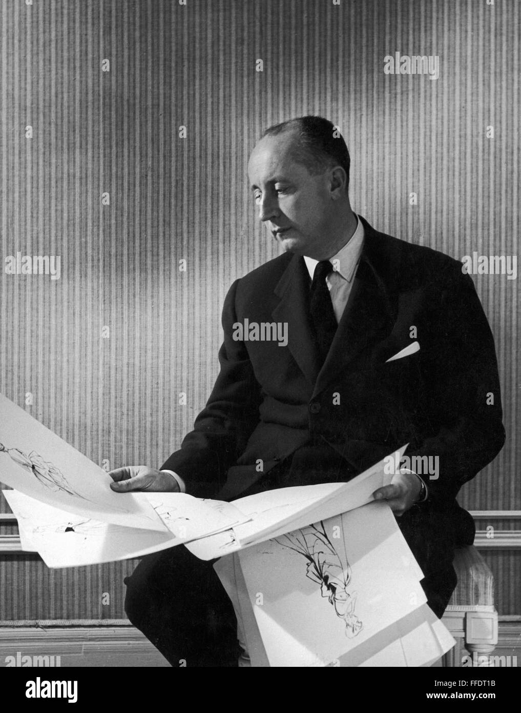 CHRISTIAN DIOR (1905-1957). /nFrench fashion designer. Dior looking ...