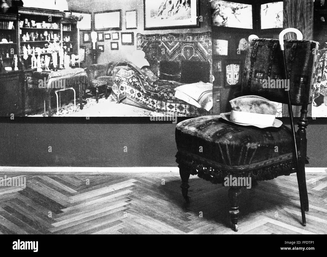 FREUD'S STUDIO. /nMuseum display featuring Sigmund Freud's hat and cane ...