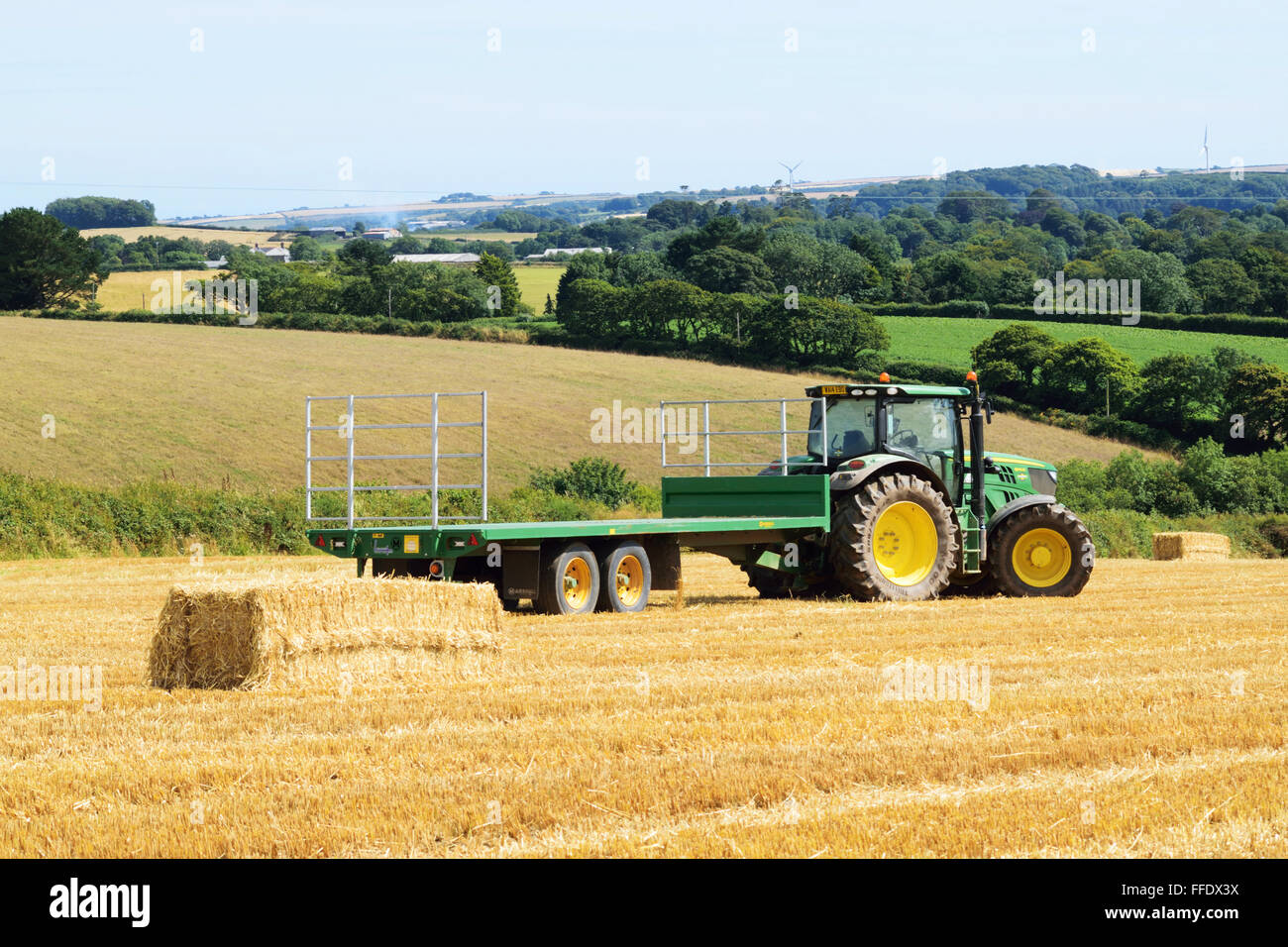 Threshing machine. Summer in England .The corn is gathered in and the ...