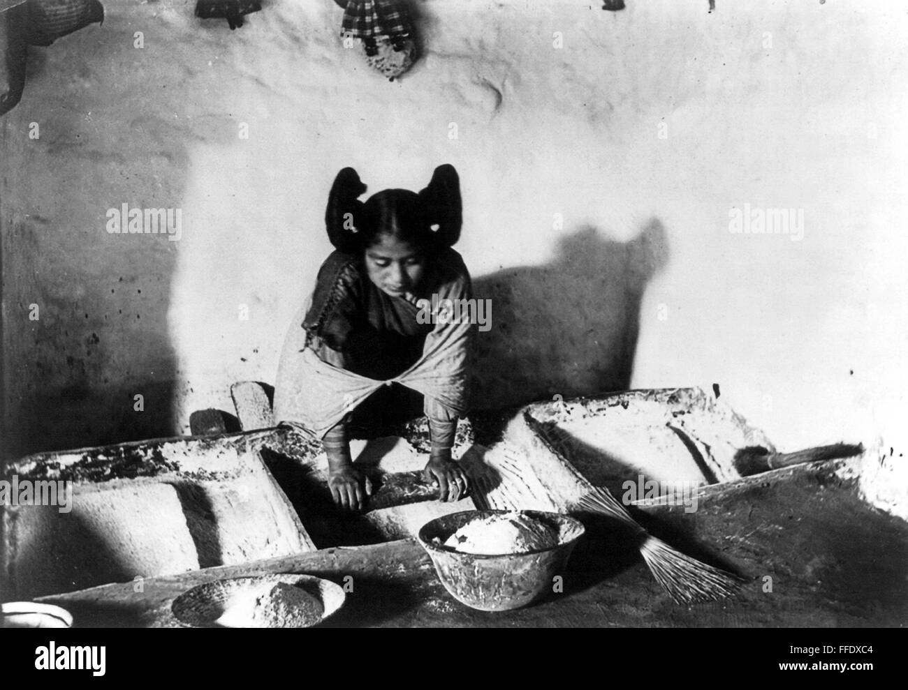 HOPI GRINDING CORN, c1909. /nA Hopi maiden in Arizona grinding corn ...