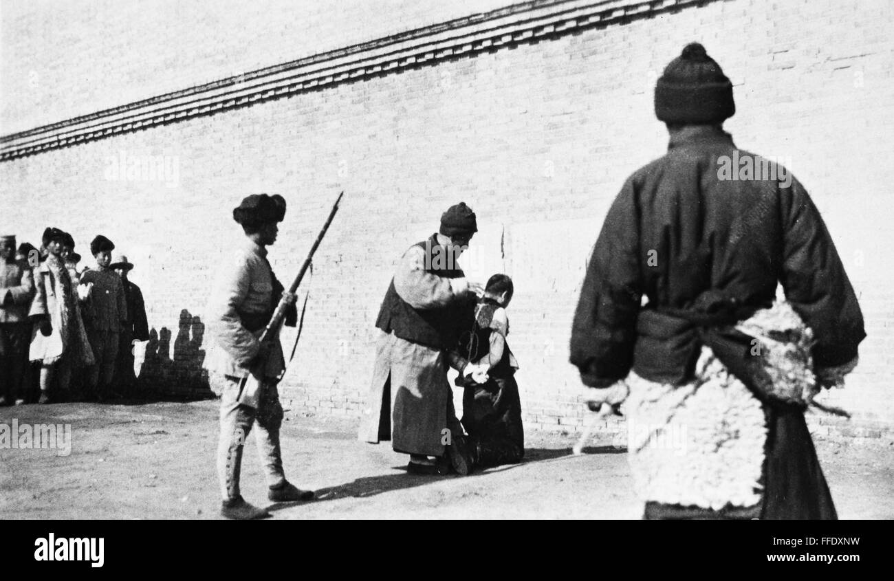 CHINA: EXECUTION, c1935. /nSpectators watch as a man is prepared for ...