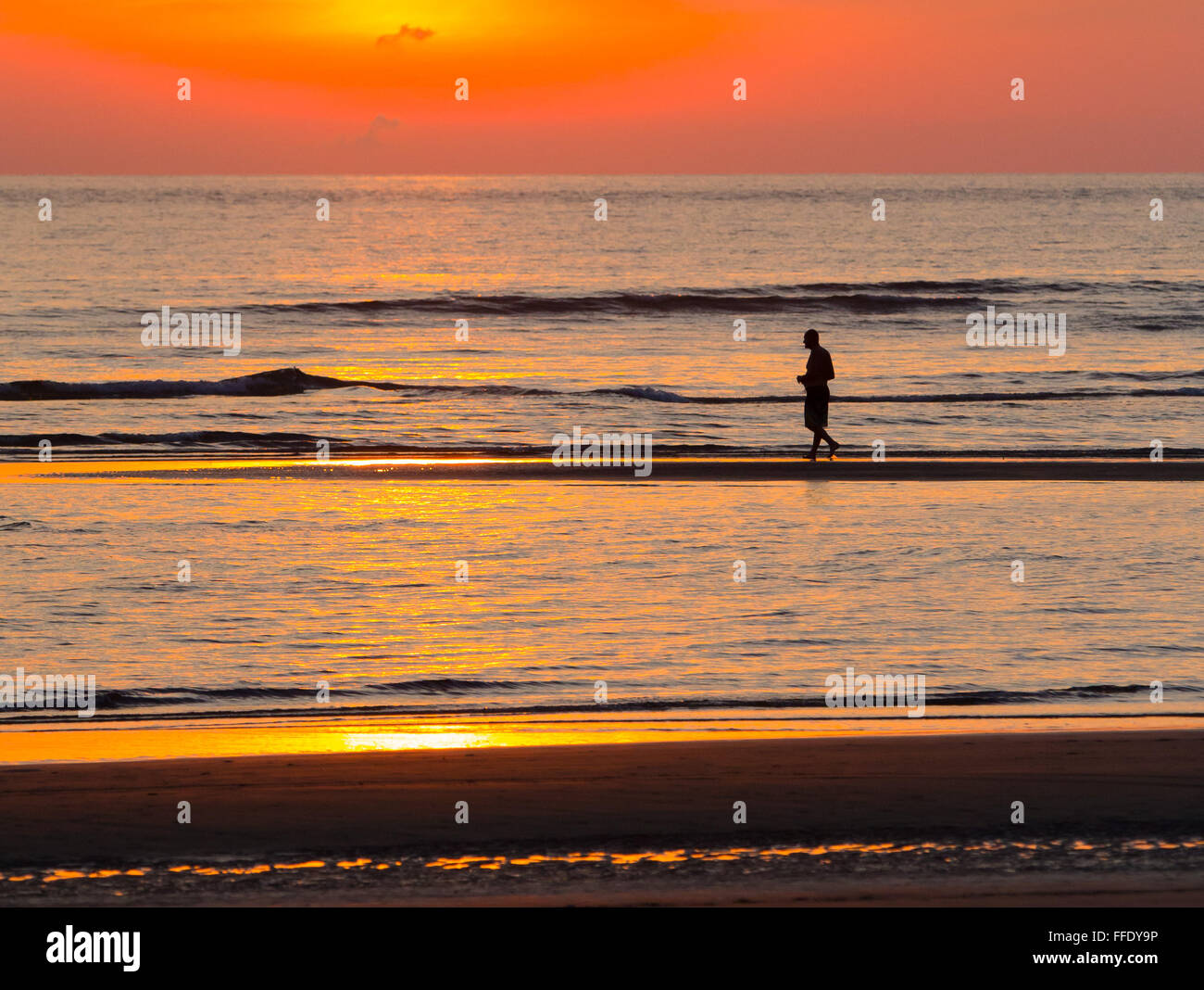 Man standing by the sea hi-res stock photography and images - Alamy