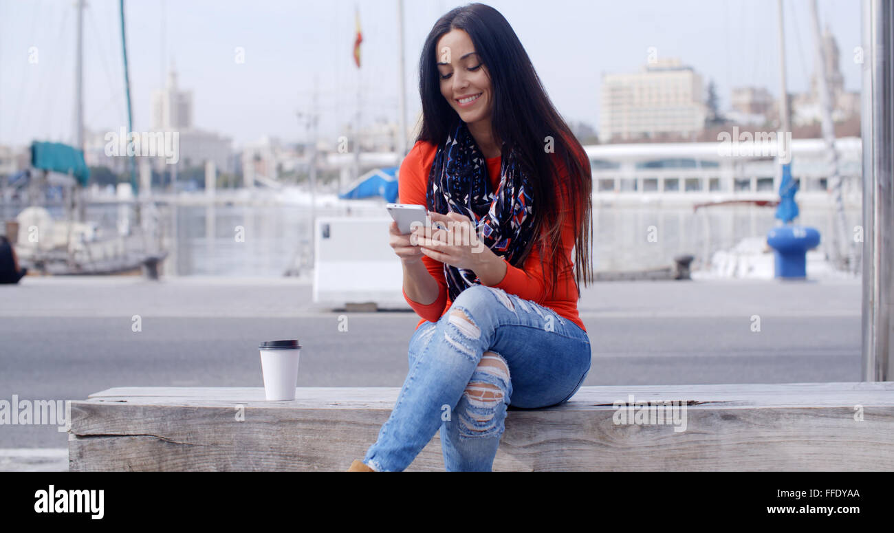 Relaxed confident young woman on a mobile Stock Photo - Alamy